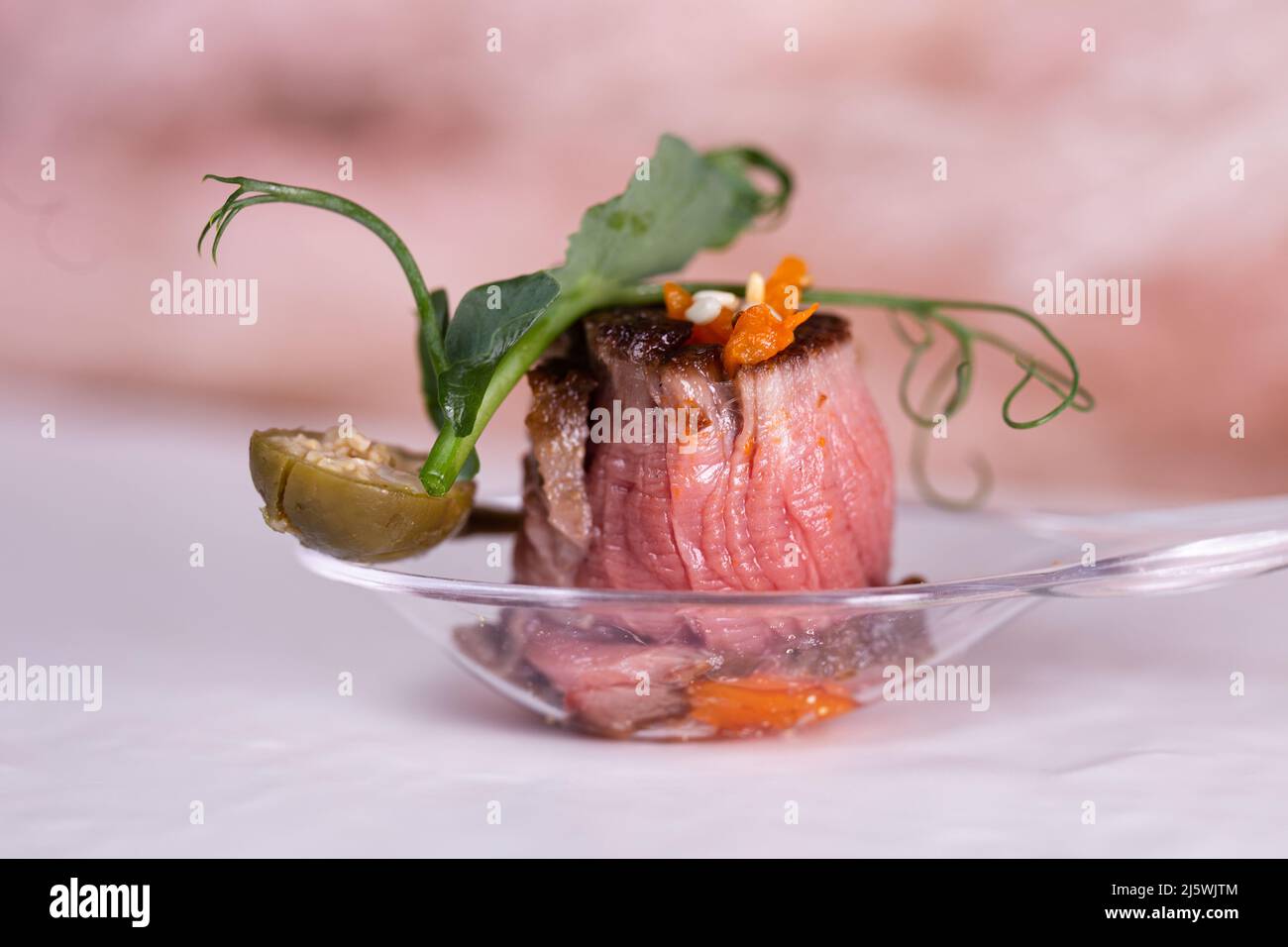 a piece of beef meat with capers close-up Stock Photo - Alamy