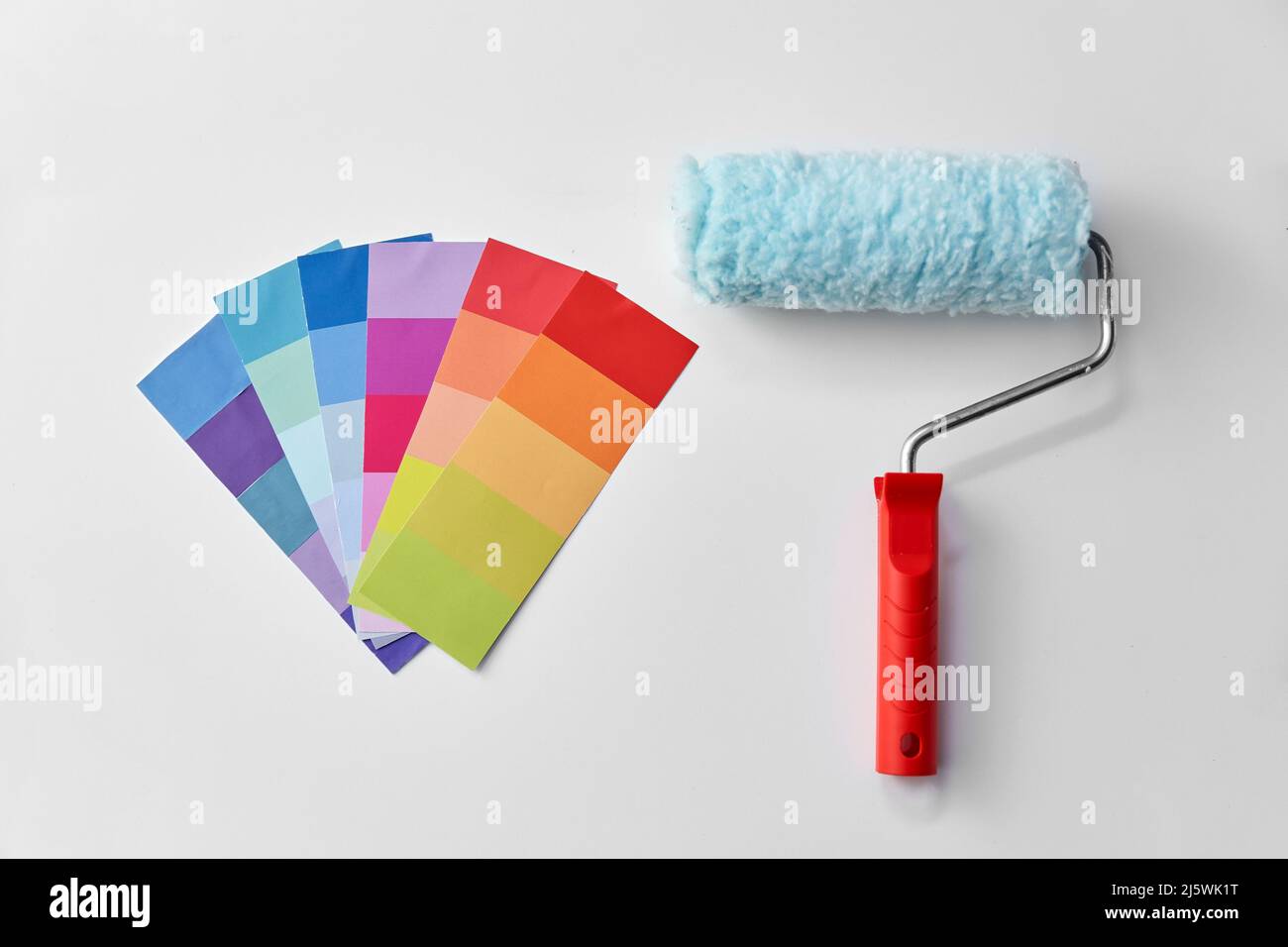paint roller and color palette on white background Stock Photo - Alamy
