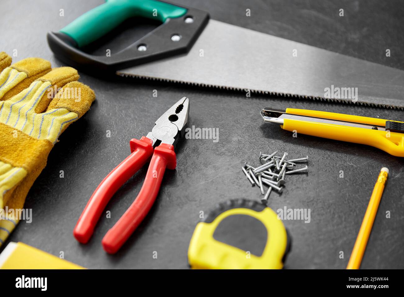 different work tools on slate background Stock Photo - Alamy