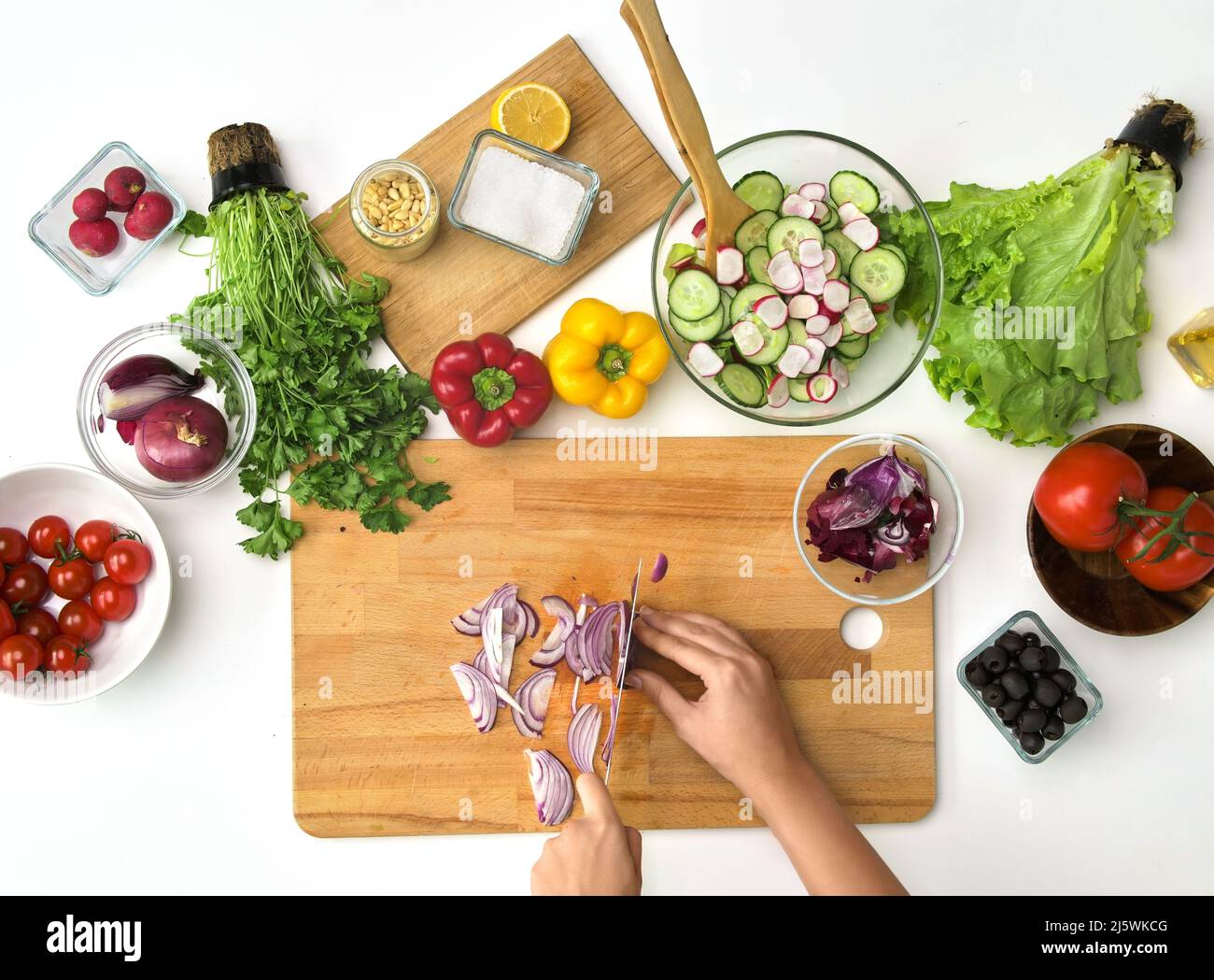 Woman hand cutting red onion hi-res stock photography and images - Alamy