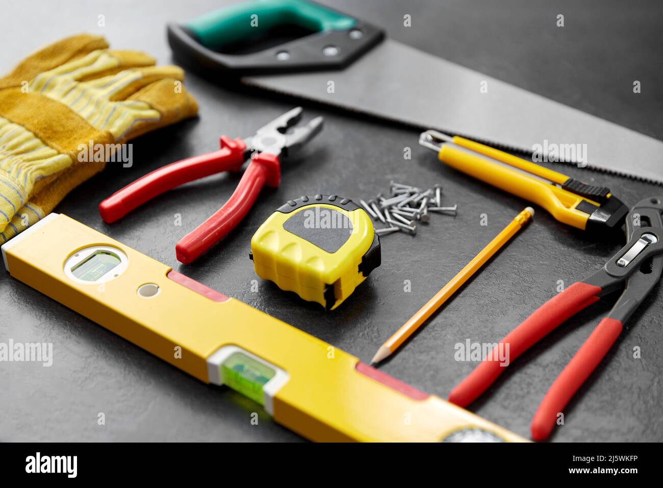 different work tools on slate background Stock Photo - Alamy