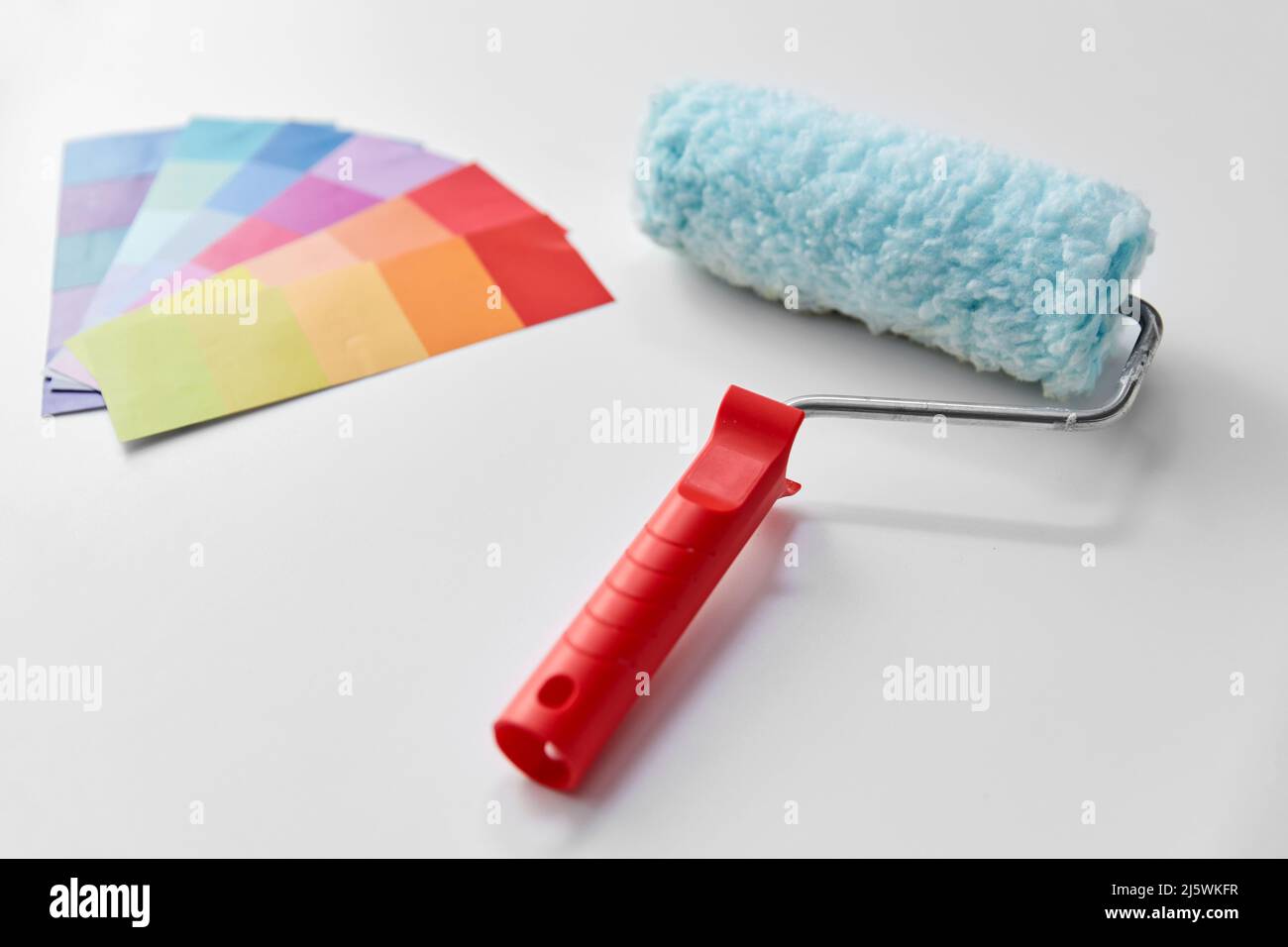 paint roller and color palette on white background Stock Photo - Alamy