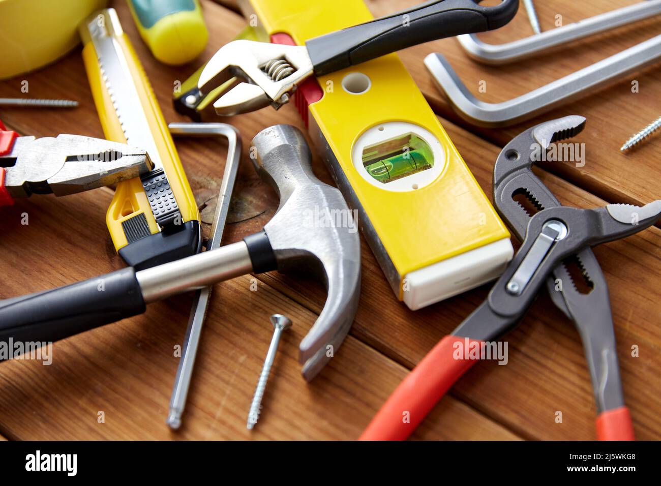 different work tools on wooden boards background Stock Photo - Alamy