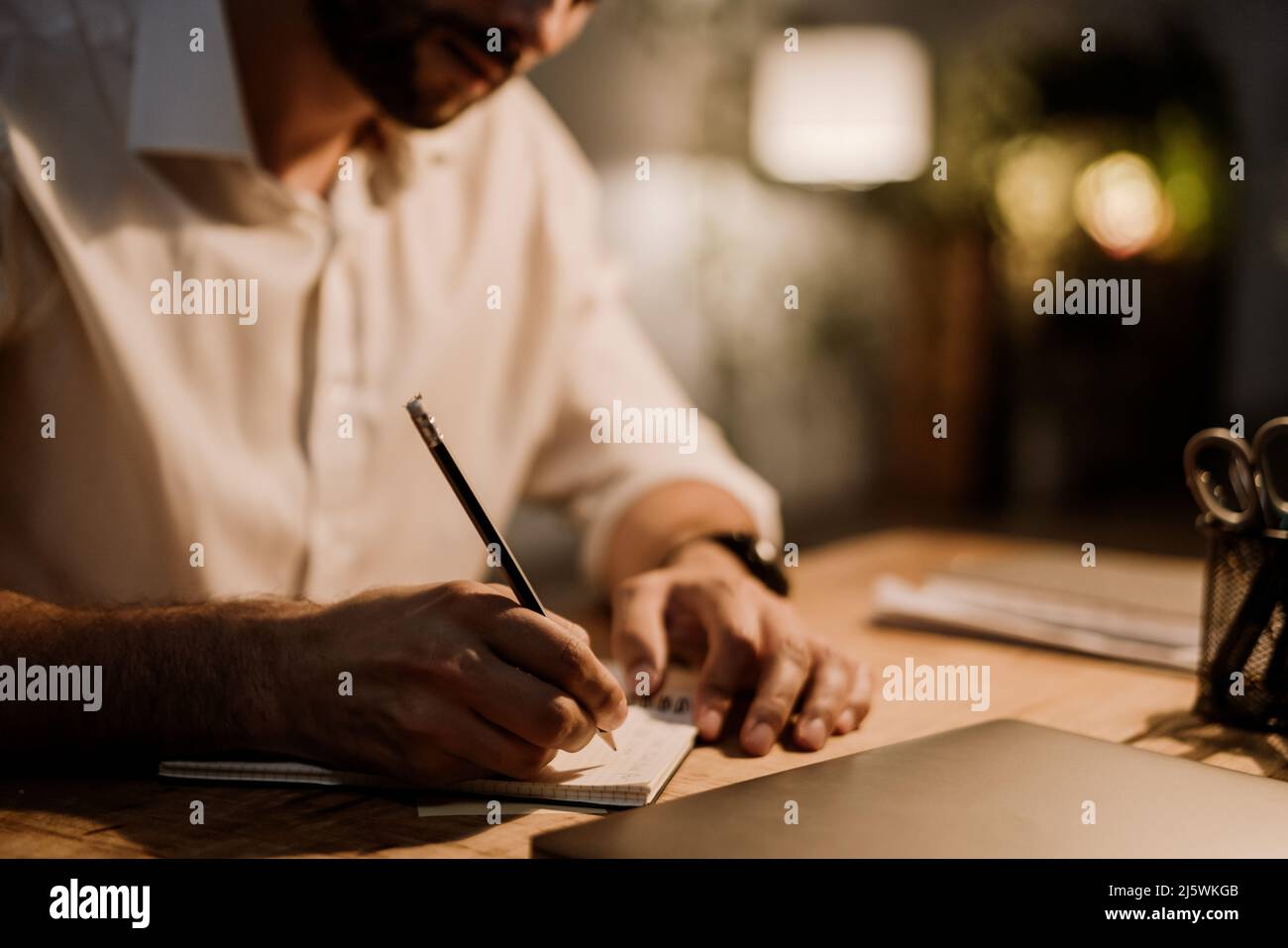 Bearded man writing hi-res stock photography and images - Alamy