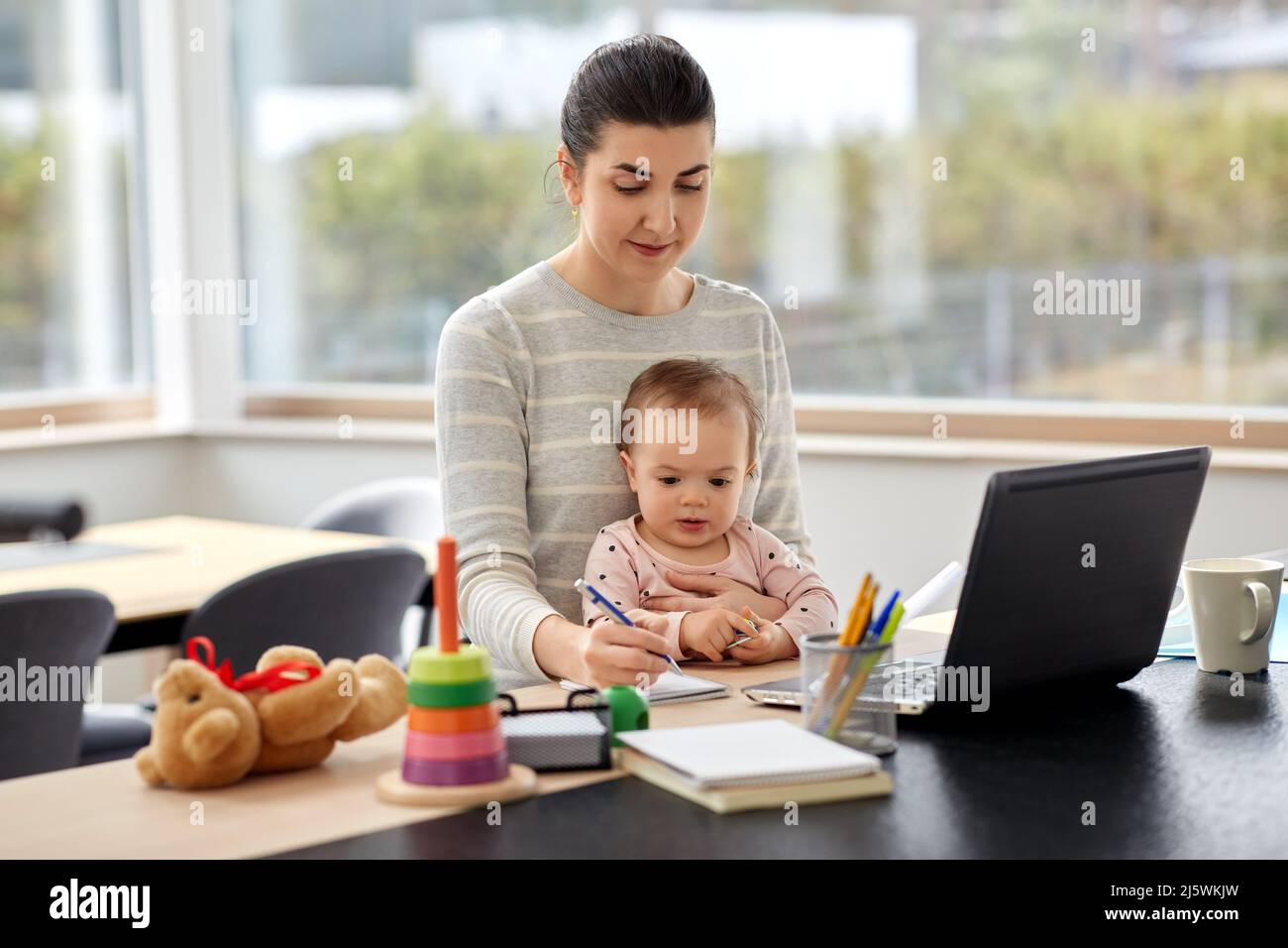Woman work baby office hi-res stock photography and images - Alamy