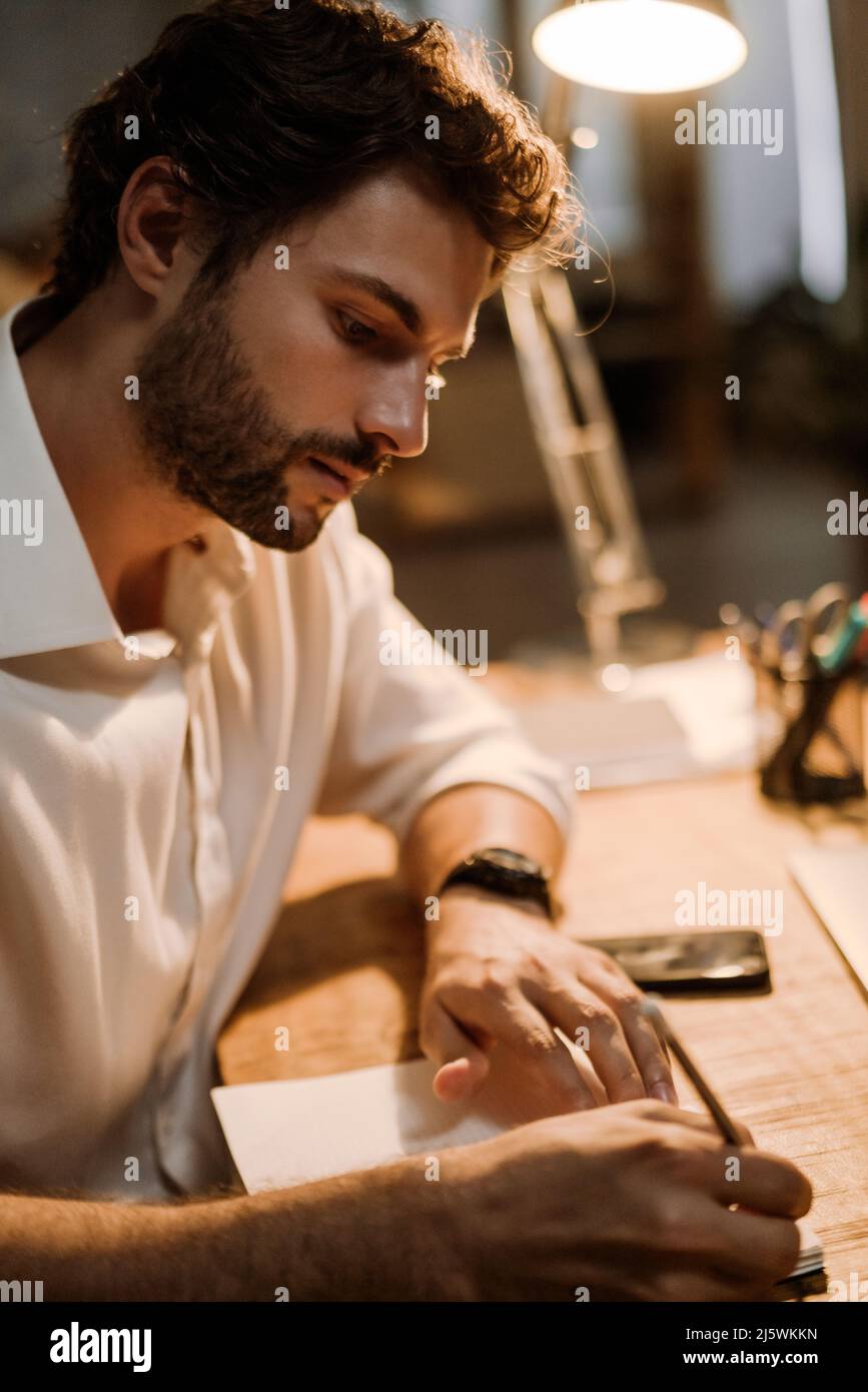Bearded man writing hi-res stock photography and images - Alamy