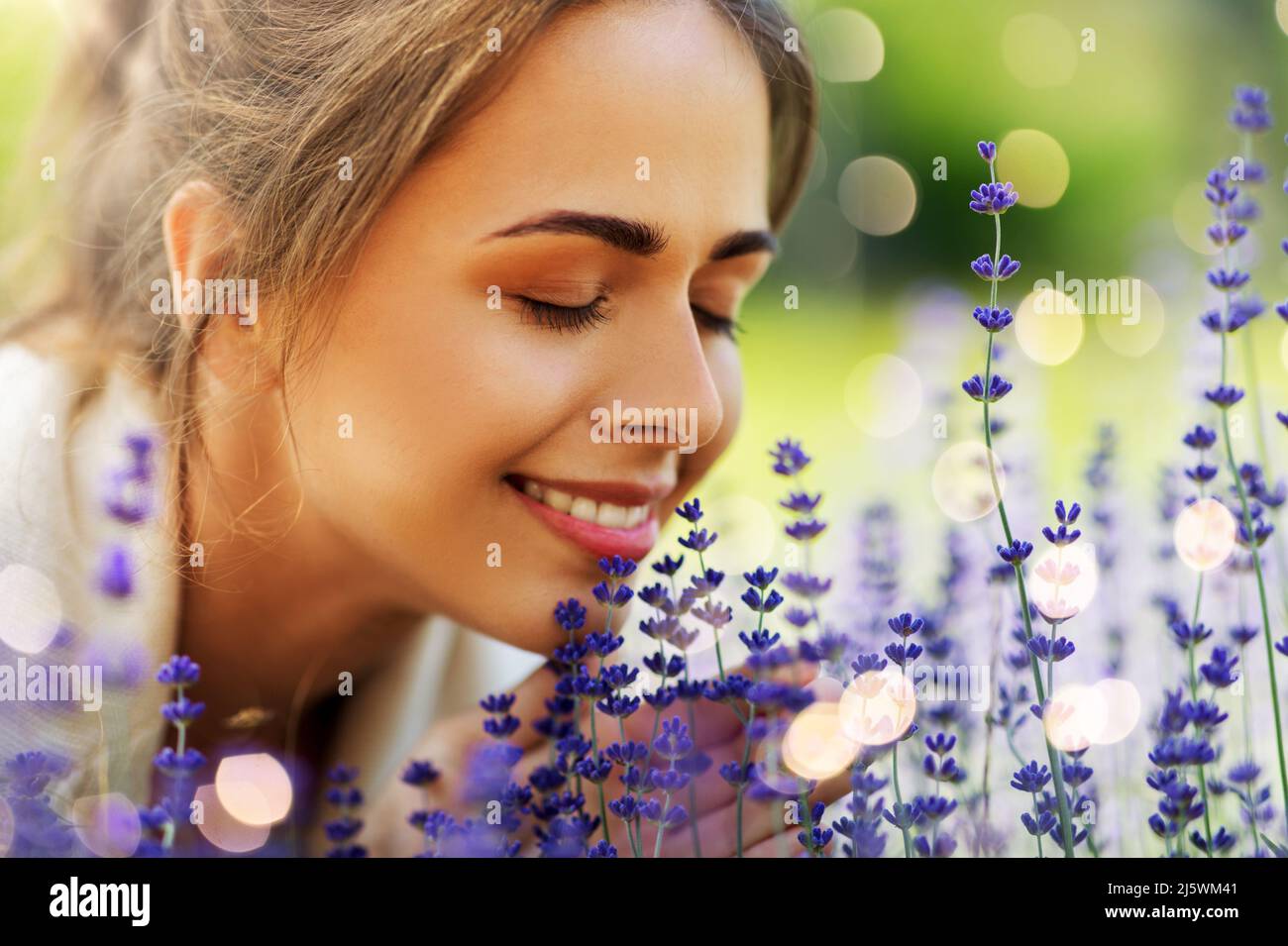 Woman smelling lavender flowers hi-res stock photography and images - Alamy