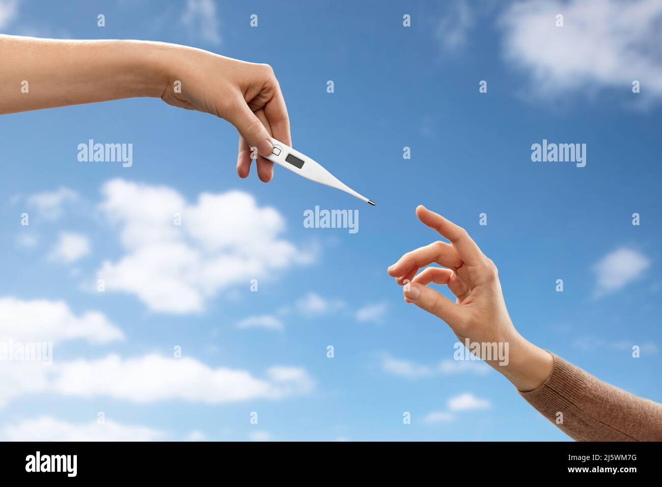 close up of hands giving each other thermometer Stock Photo - Alamy