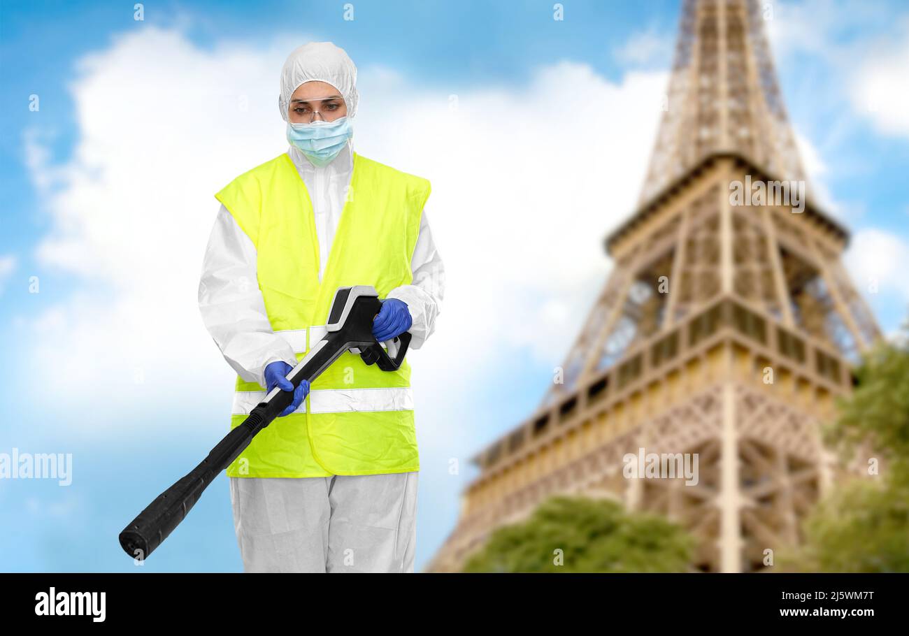 sanitation worker in hazmat with pressure washer Stock Photo - Alamy