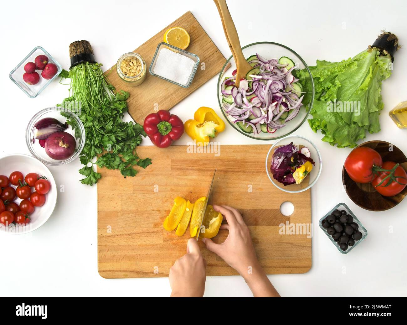 Female hands chopping yellow hi-res stock photography and images - Alamy