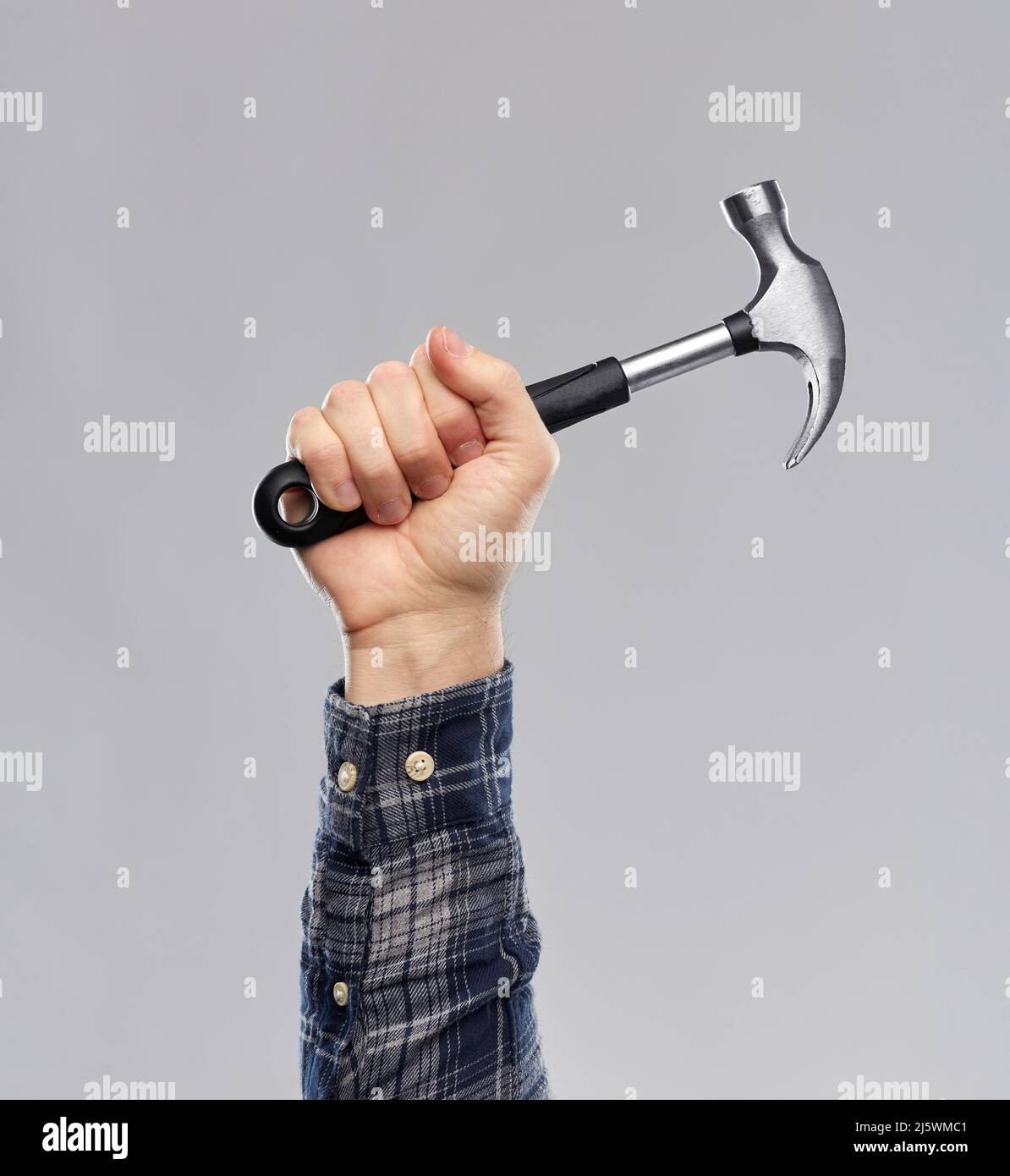 Hand holding hammer hi-res stock photography and images - Alamy