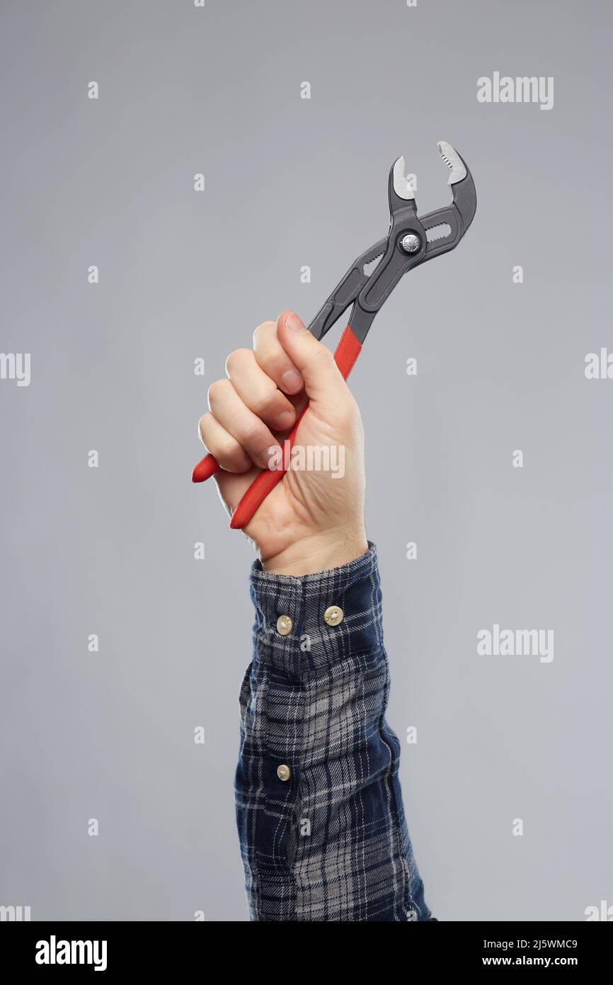 Hand holding wrench hi-res stock photography and images - Alamy