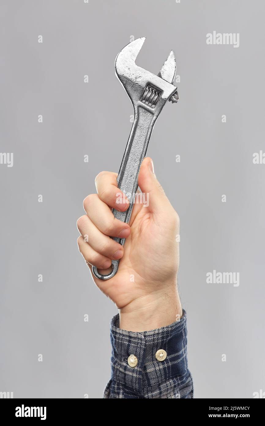 Hand holding wrench hi-res stock photography and images - Alamy