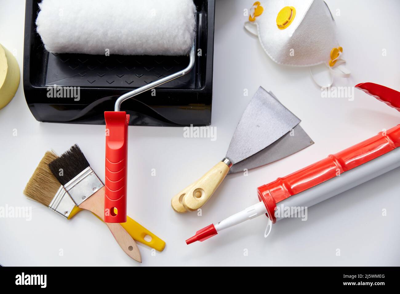 different painting work tools on white background Stock Photo - Alamy