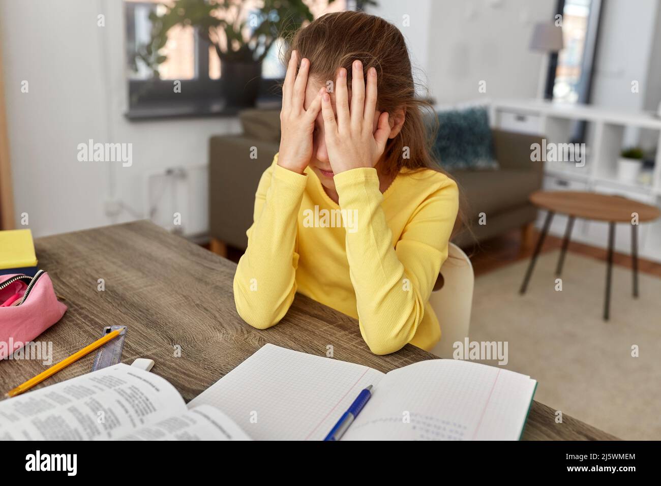 stressed little student girl learning at home Stock Photo - Alamy