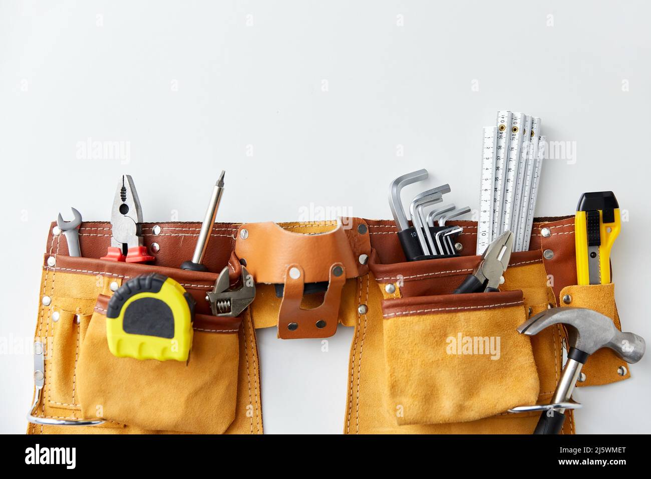 different work tools in belt on white background Stock Photo - Alamy