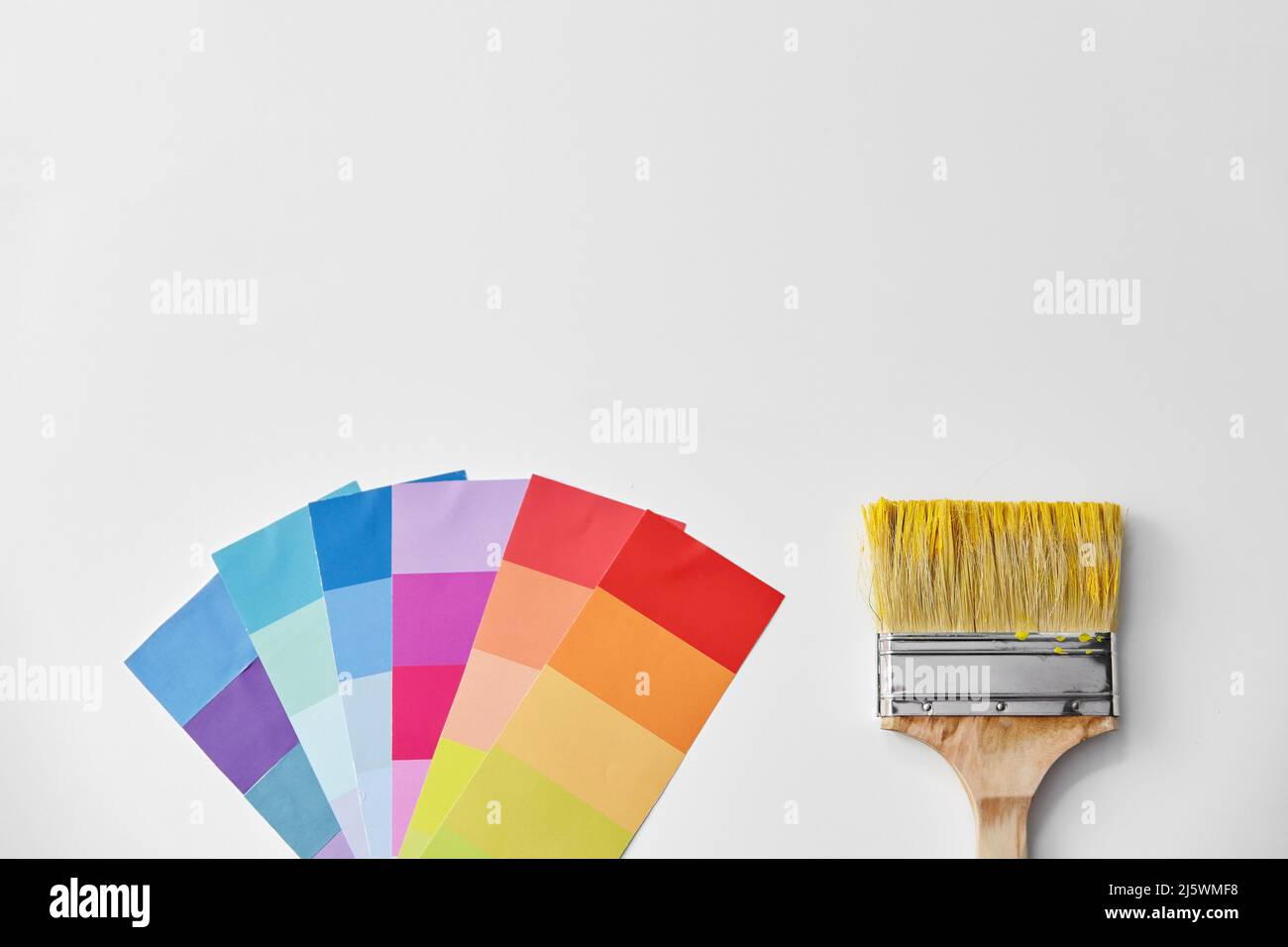 paint brush and color palette on white background Stock Photo - Alamy
