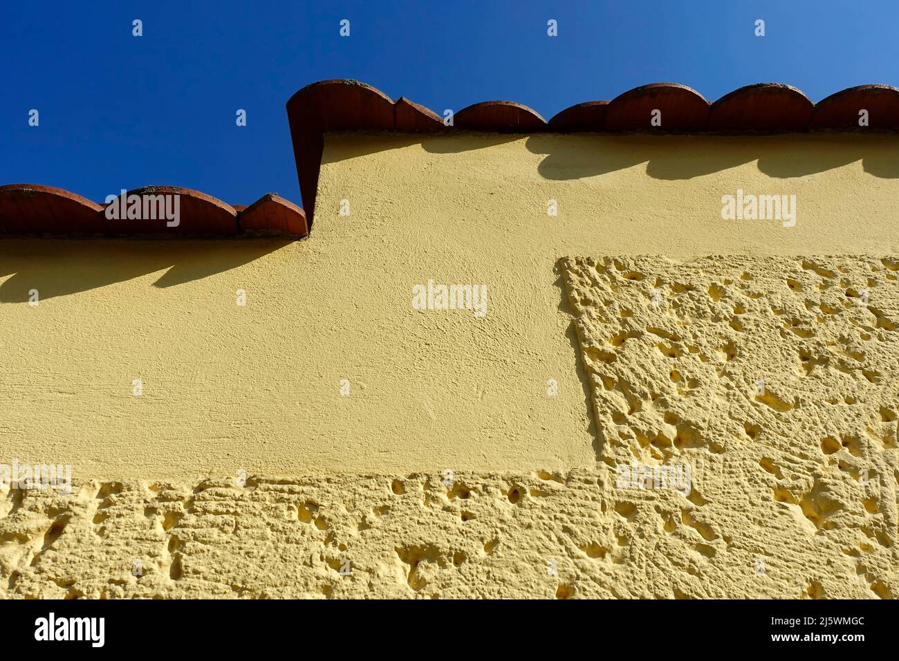 High wall around a property Stock Photo - Alamy