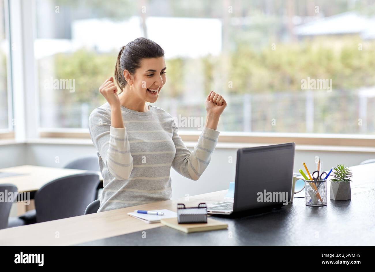 happy woman with laptop working at home office Stock Photo - Alamy