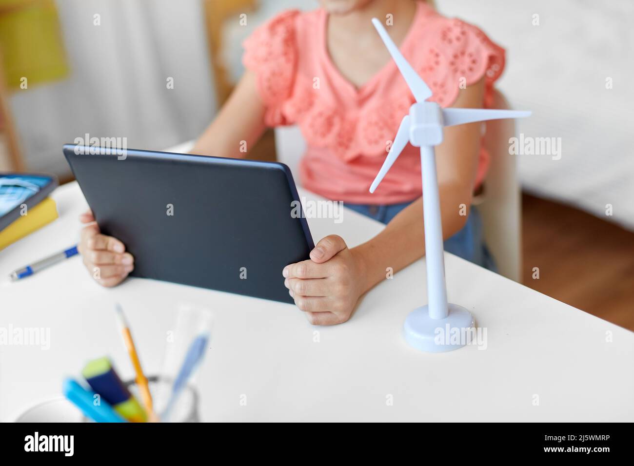 student girl with tablet pc and wind turbine Stock Photo - Alamy