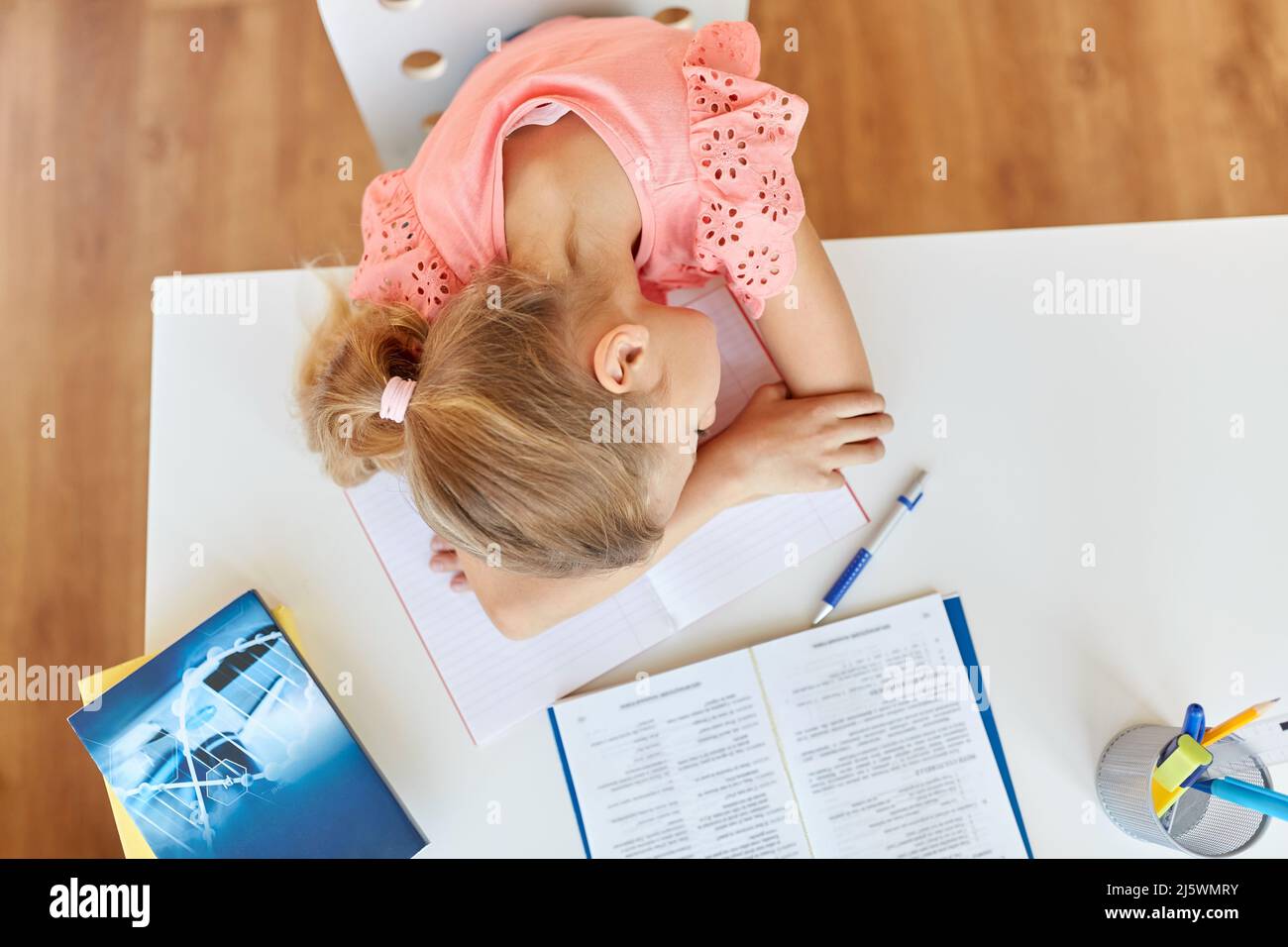 tired student girl sleeping on table at home Stock Photo - Alamy