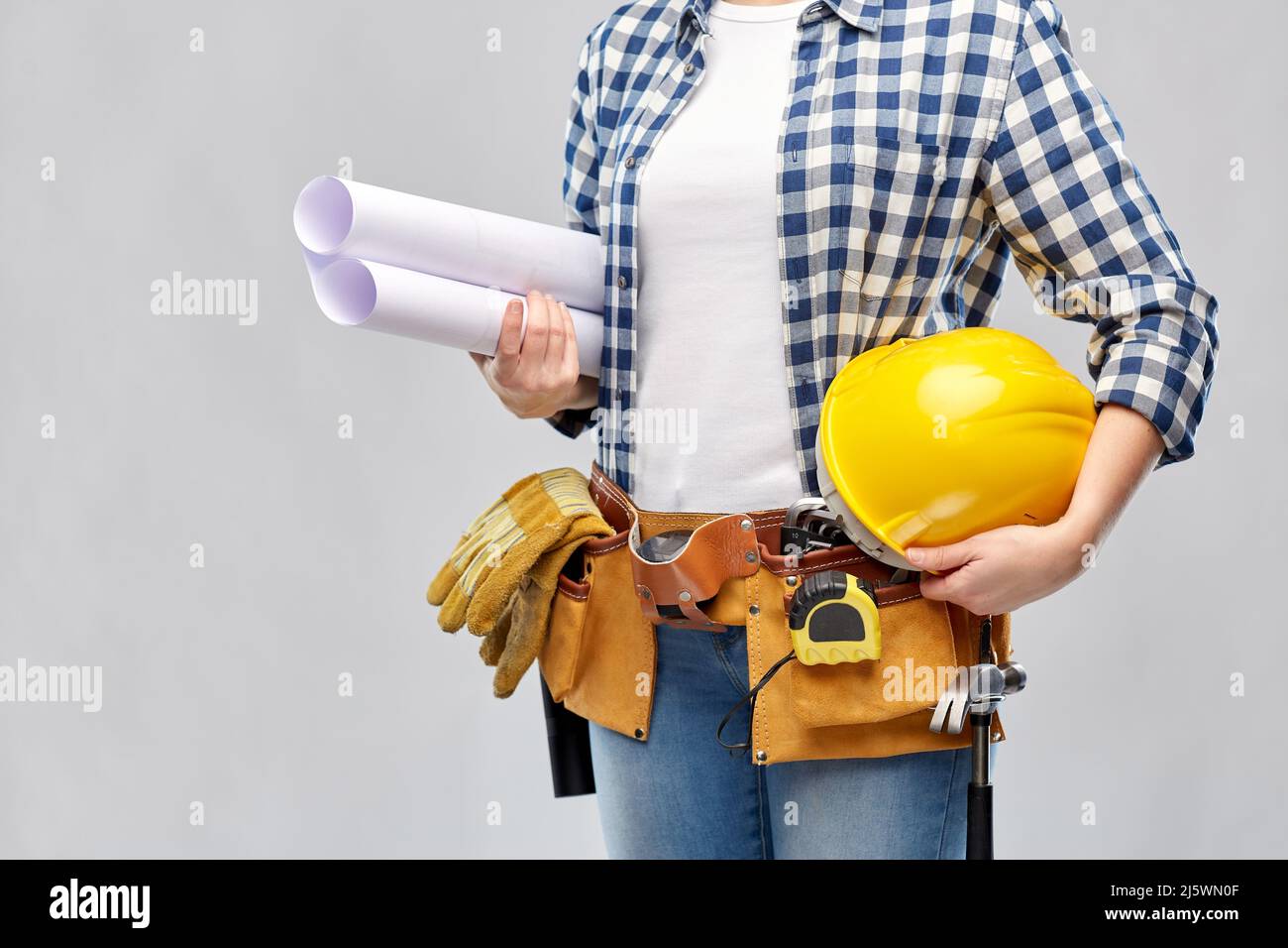 builder with helmet, blueprint and working tools Stock Photo - Alamy
