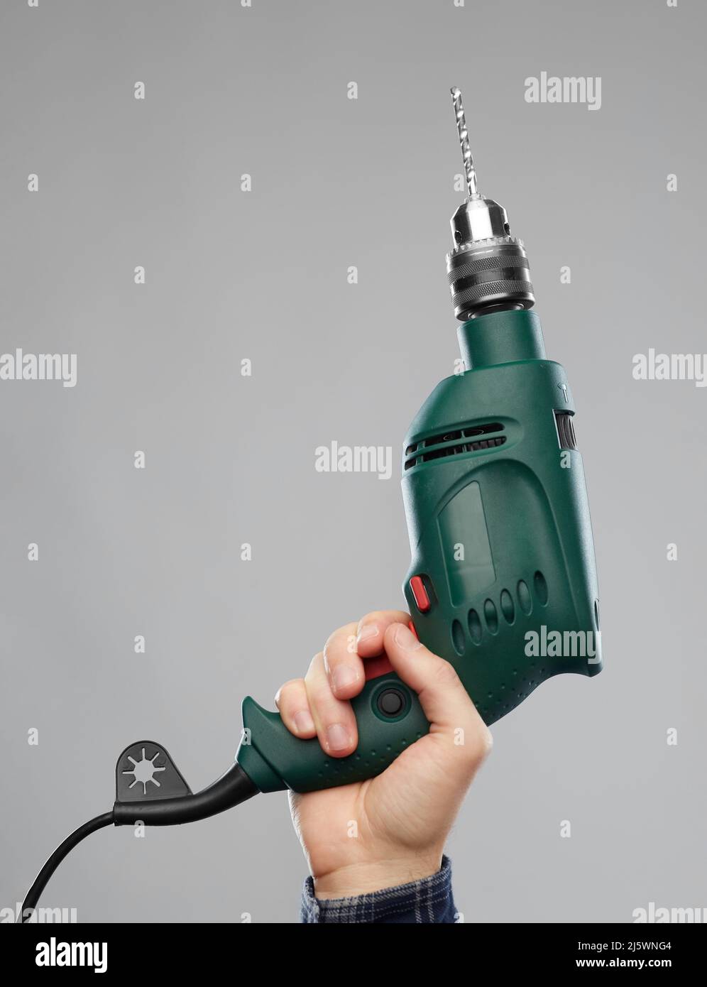 Hand holding drill hi-res stock photography and images - Alamy
