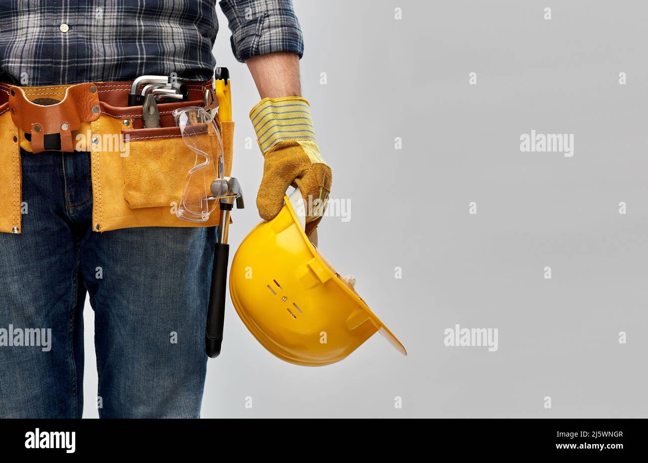 worker or builder with helmet and working tools Stock Photo - Alamy