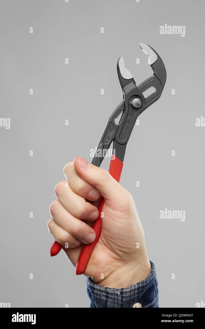 Hand holding wrench hi-res stock photography and images - Alamy