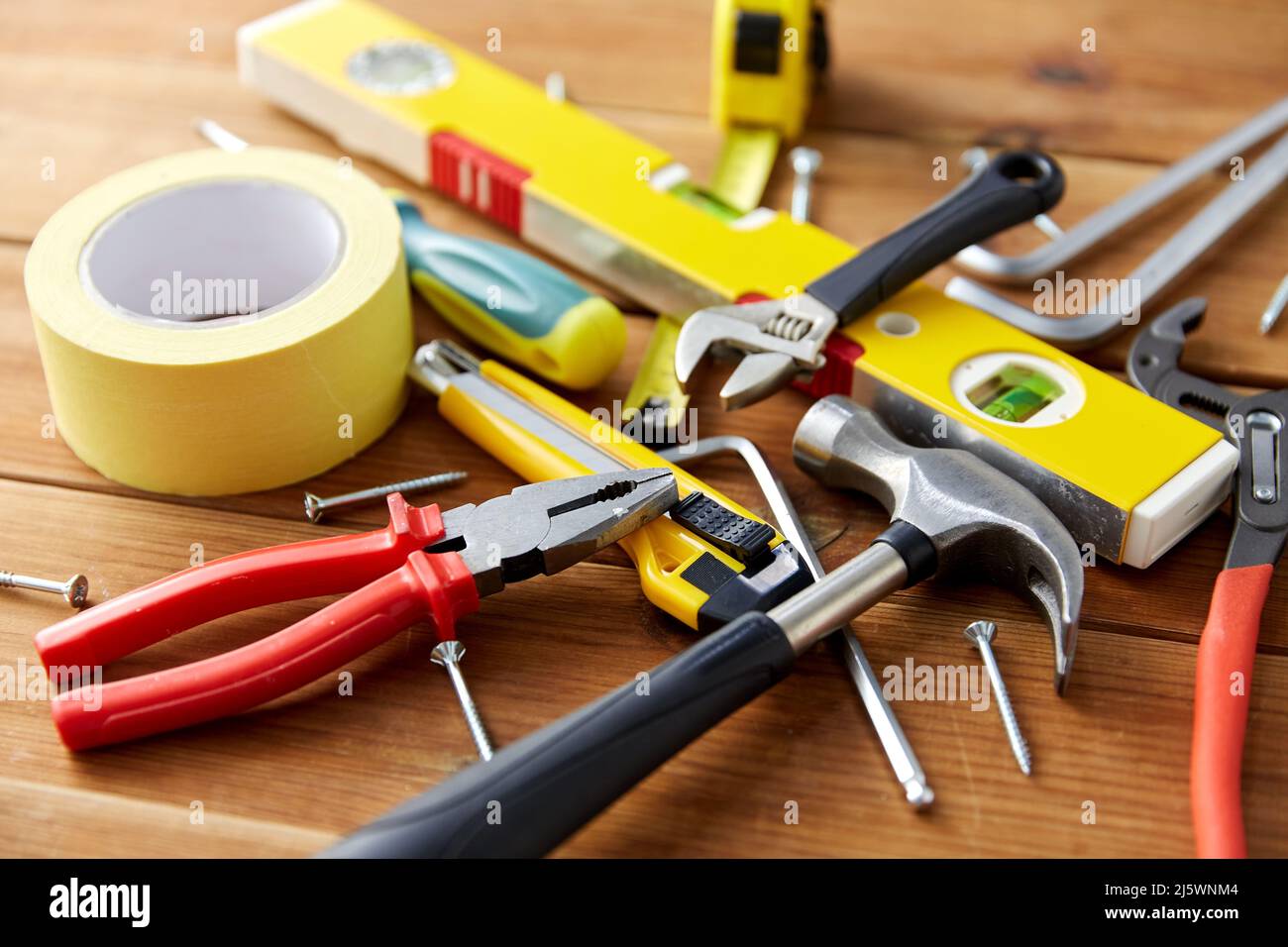 different work tools on wooden boards background Stock Photo - Alamy