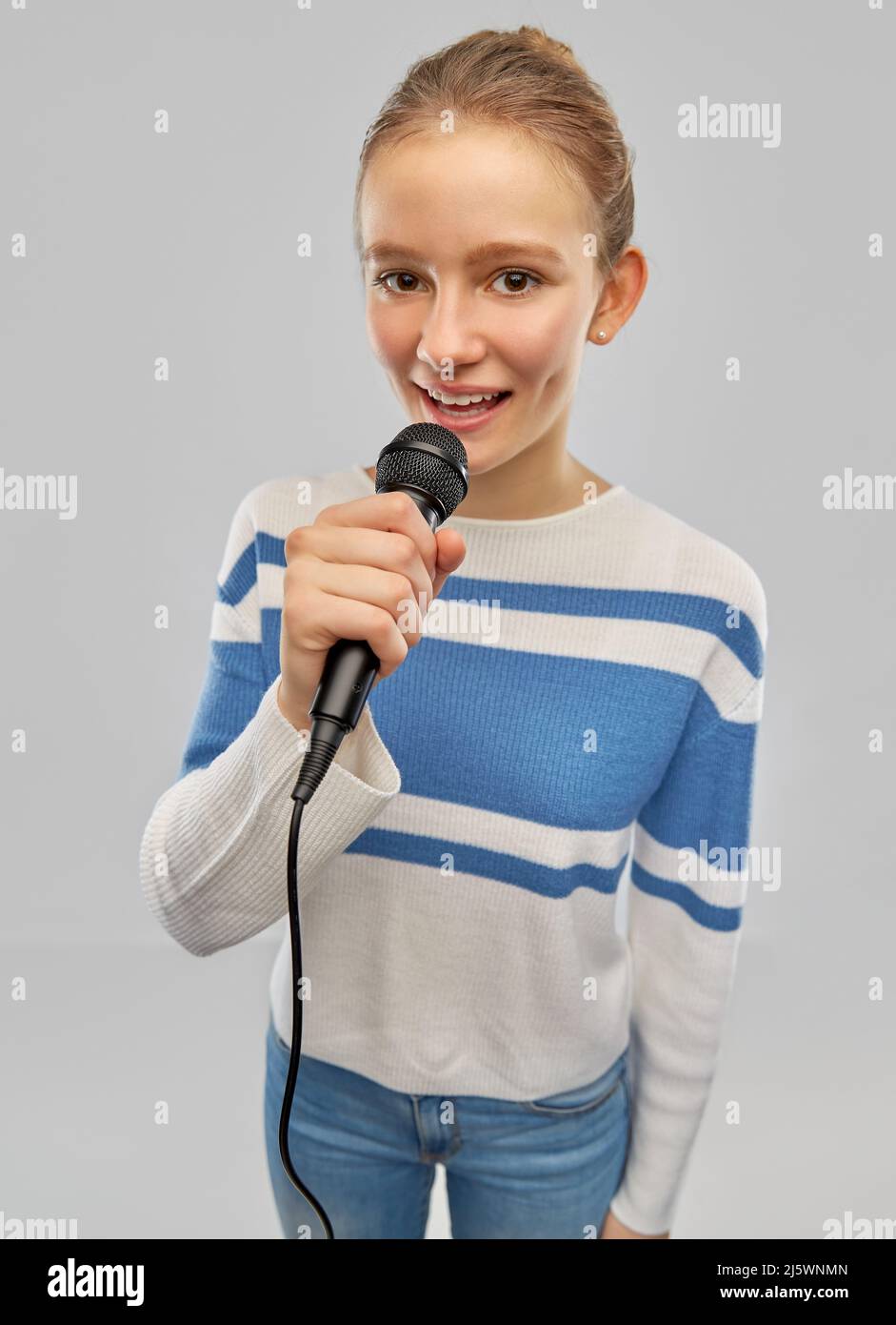 Child teen girl singing microphone hi-res stock photography and images ...