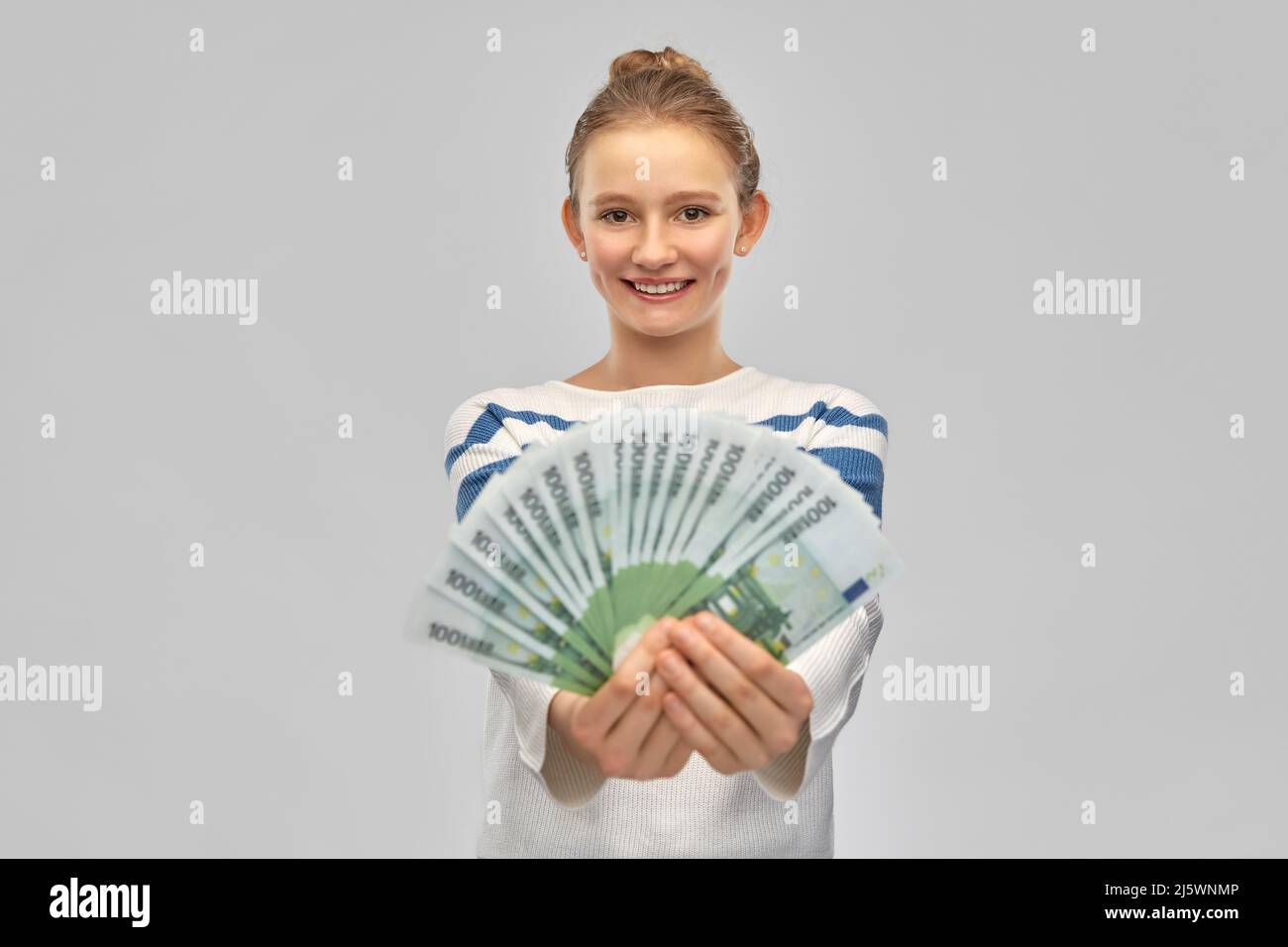 smiling teenage girl with euro money banknotes Stock Photo - Alamy