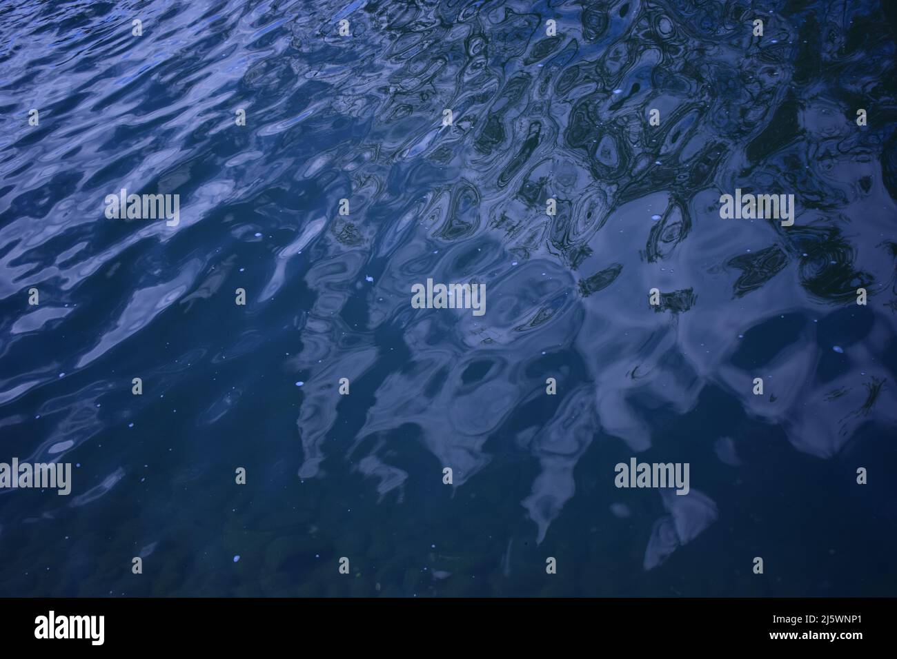 Dark blue wavy water surface. Swimming pool water texture. Blue liquid ...