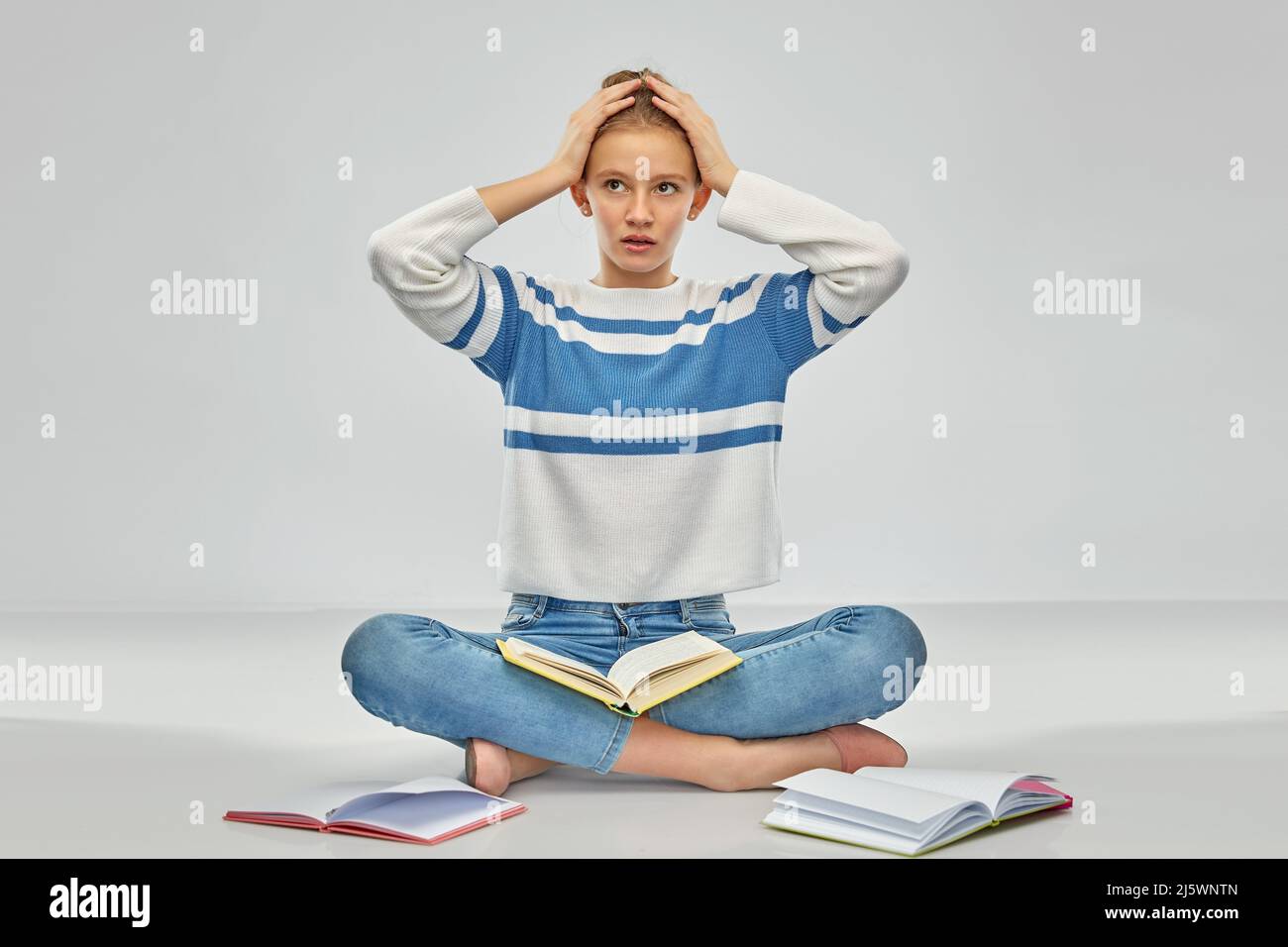 stressed teenage student girl with books Stock Photo - Alamy