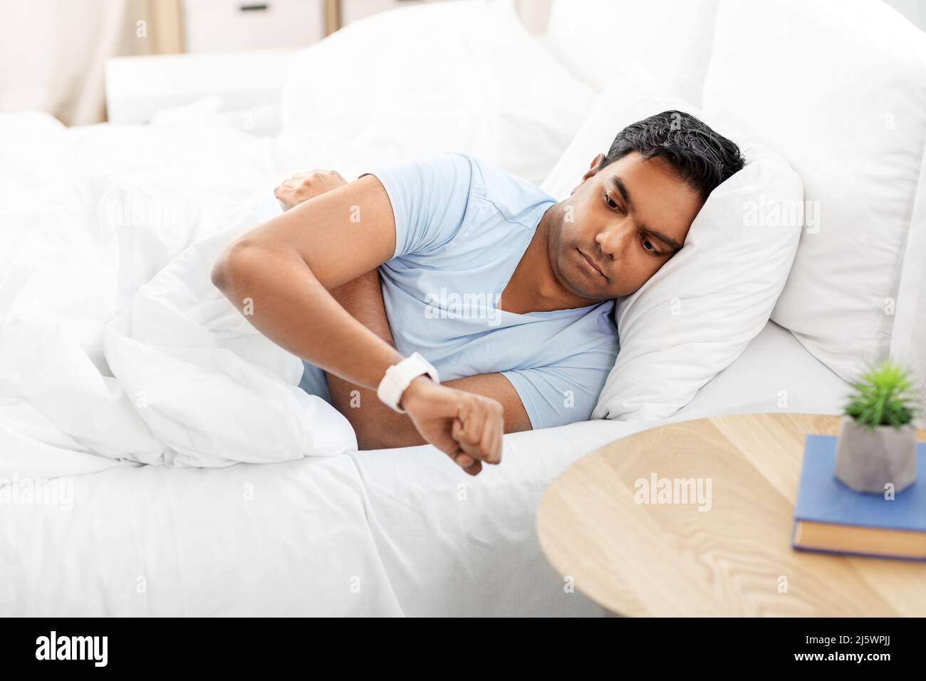 Man sleeping smartwatch guy hi-res stock photography and images - Alamy