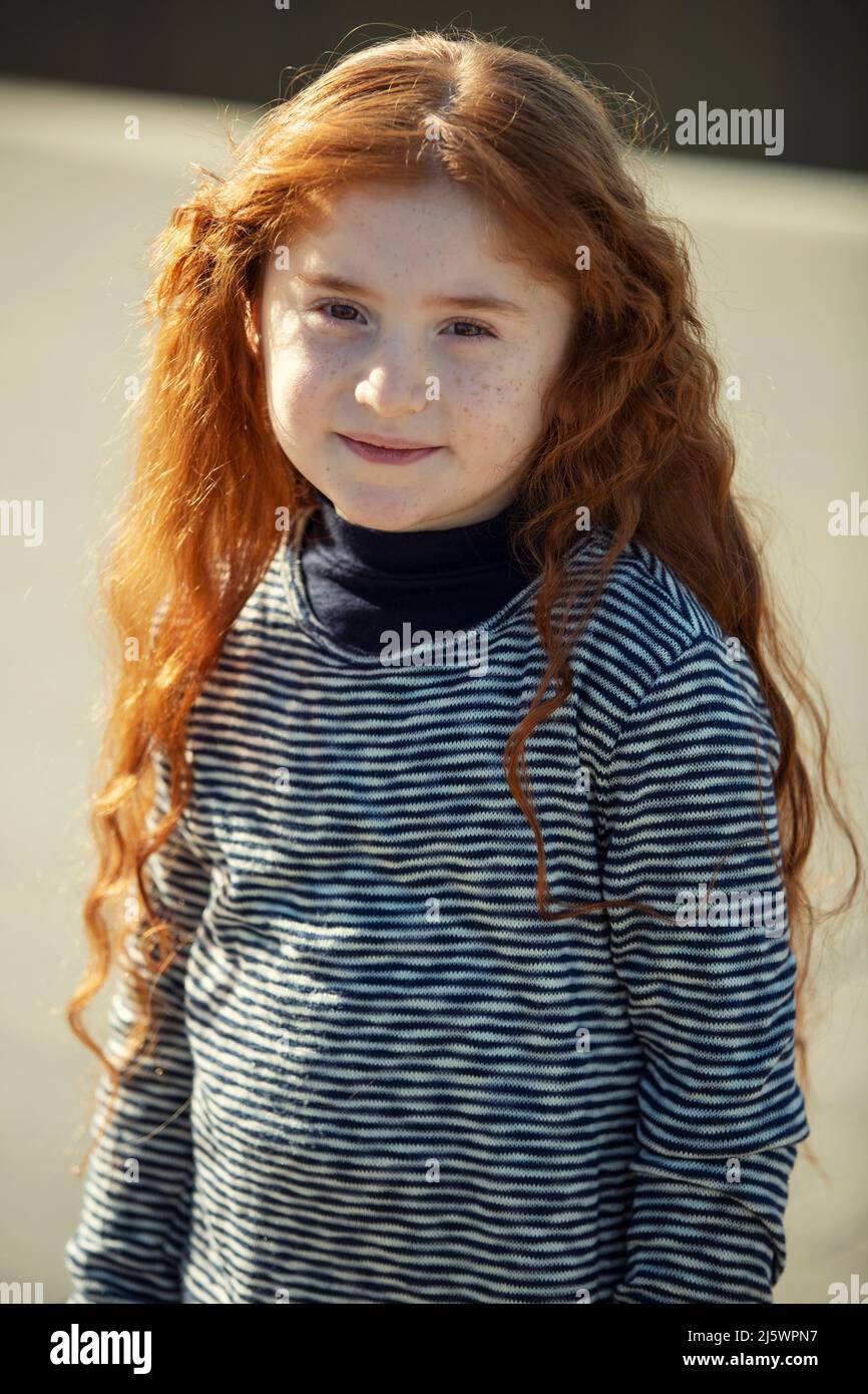Beautiful redhead girl outdoors Stock Photo - Alamy