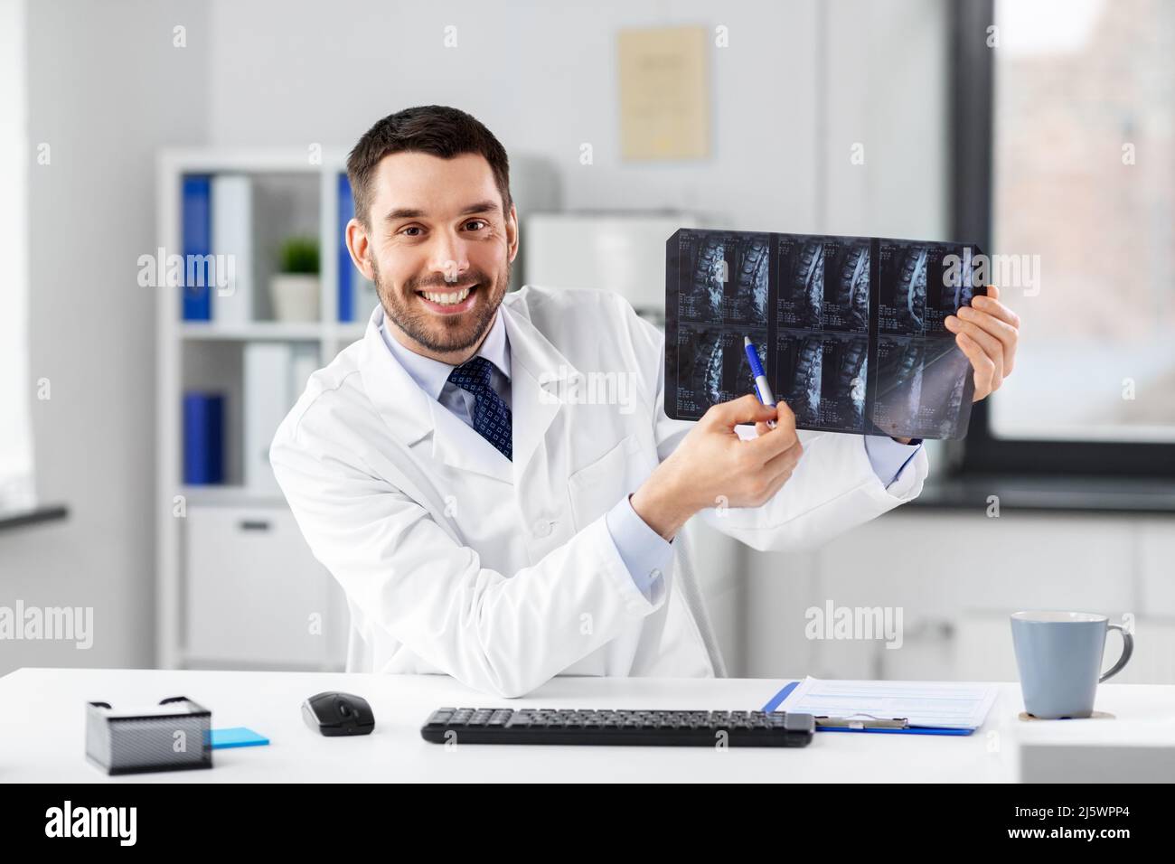 doctor with x-ray having video call at clinic Stock Photo - Alamy