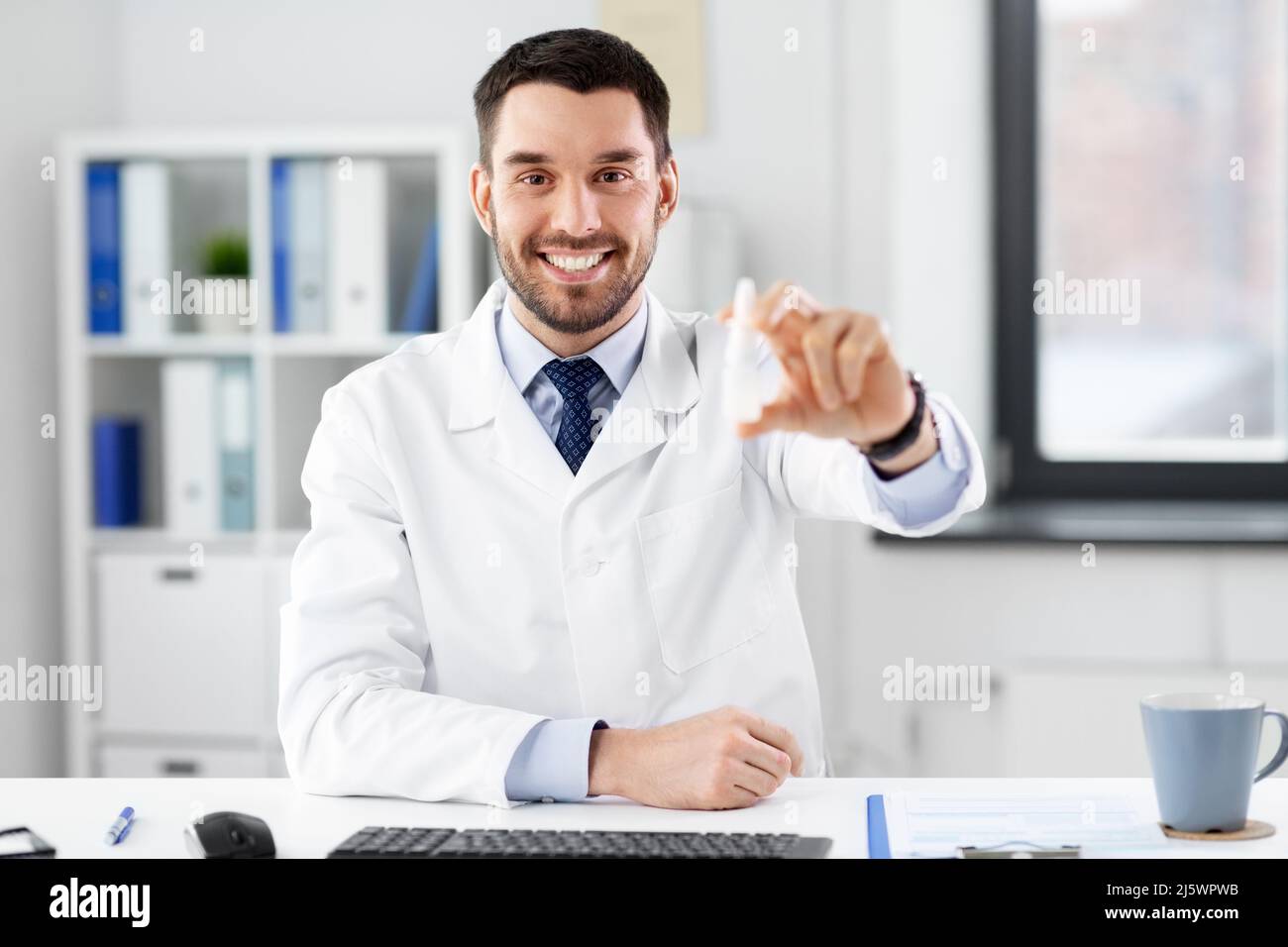 Doctor smiling indoors clinic showing hi-res stock photography and ...