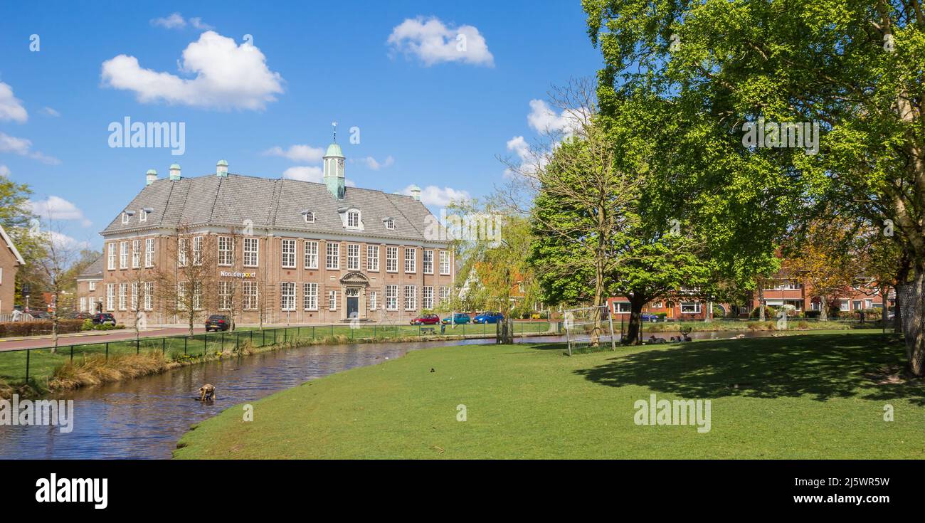 Panorama of the park and historic school building in Veendam ...