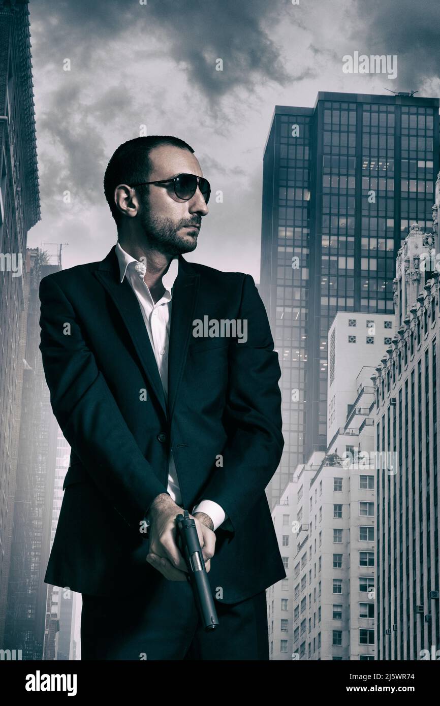 Special agent holding a gun Stock Photo - Alamy