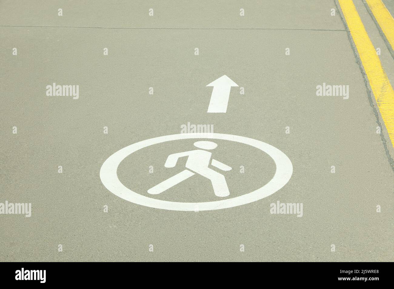 Pedestrian path sign on the asphalt road Stock Photo - Alamy
