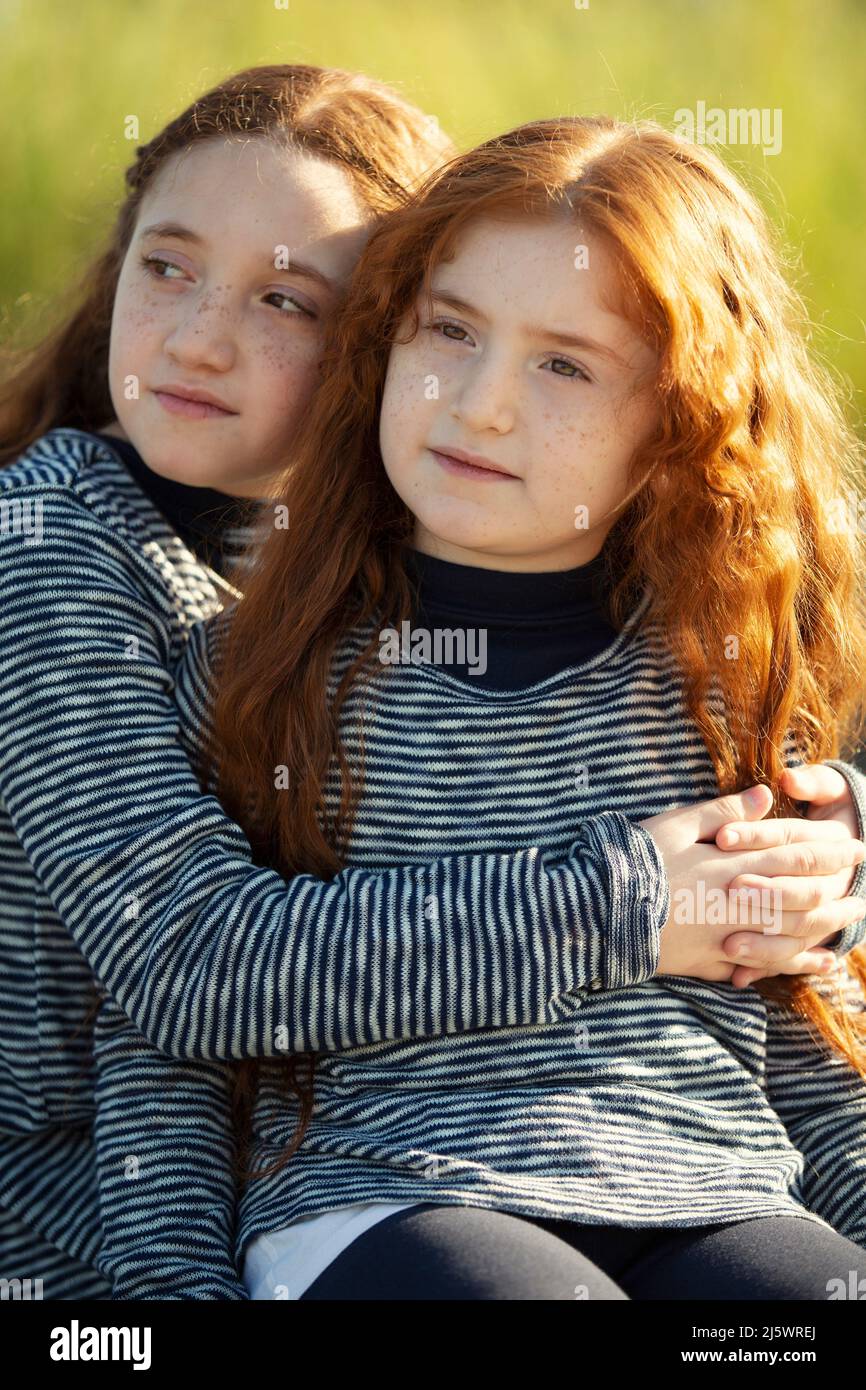 Two redhead sisters together outdoors Stock Photo - Alamy