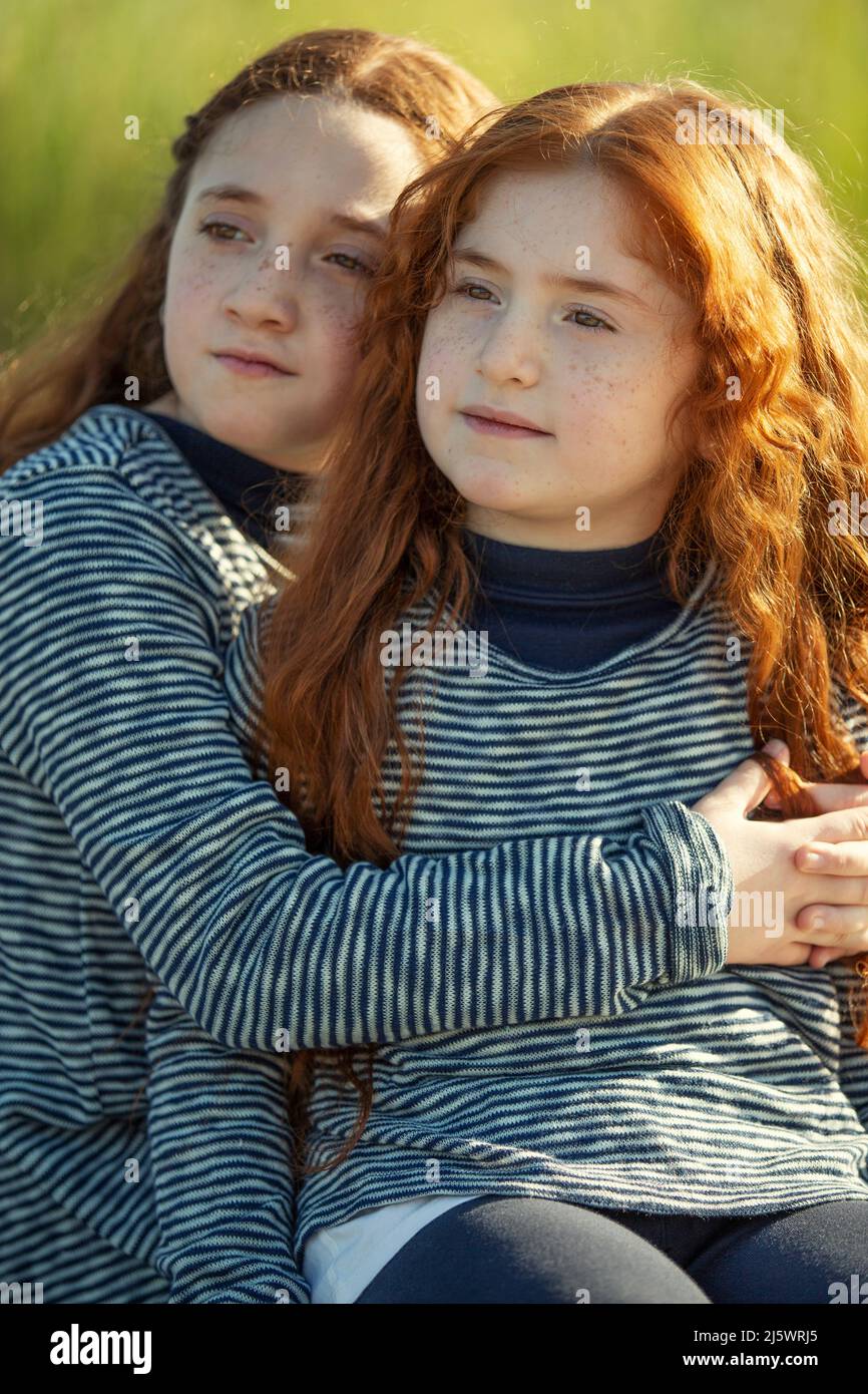 Two redhead sisters together outdoors Stock Photo - Alamy