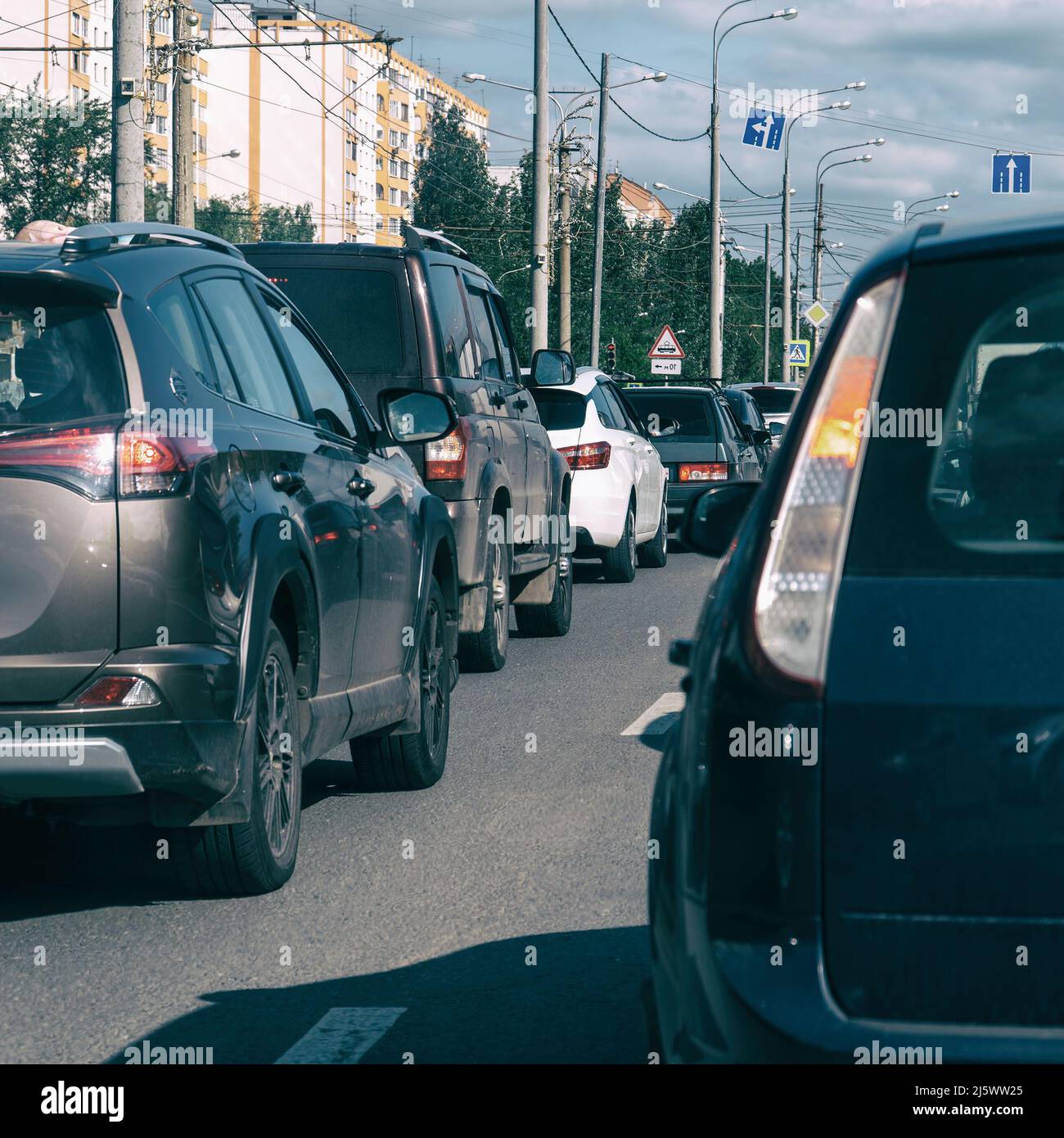 Cars standing in a traffic jam on a city street Stock Photo - Alamy
