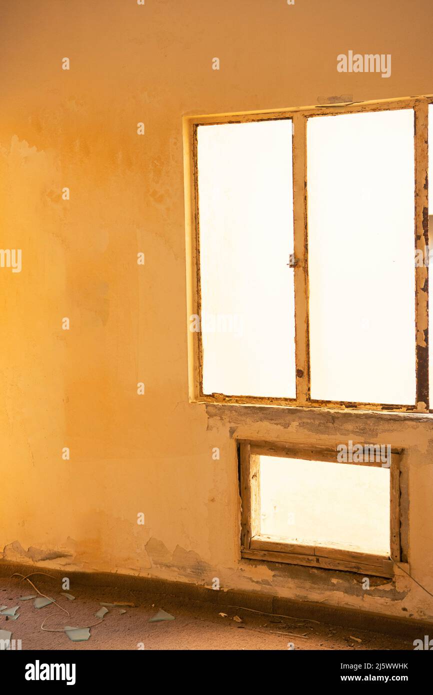 Abandoned room with broken window Stock Photo - Alamy