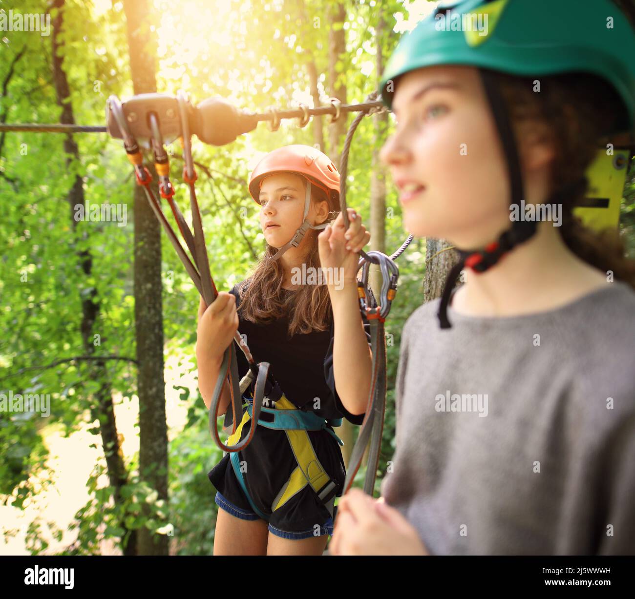 female young friends in a rope park on a sunny day Stock Photo - Alamy