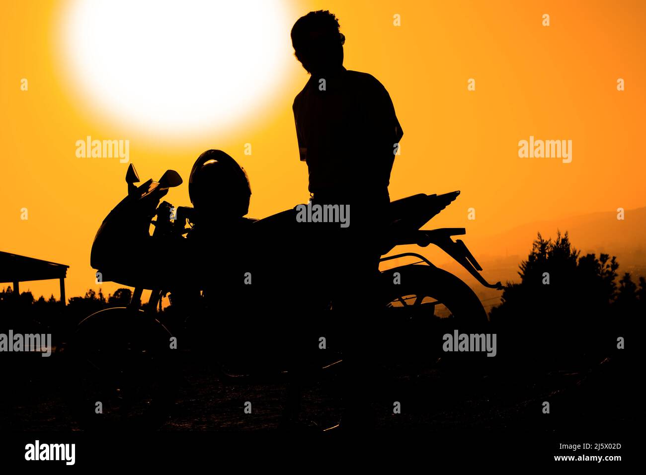 A MotorCycle Driver Is Alone in all of his life Stock Photo - Alamy