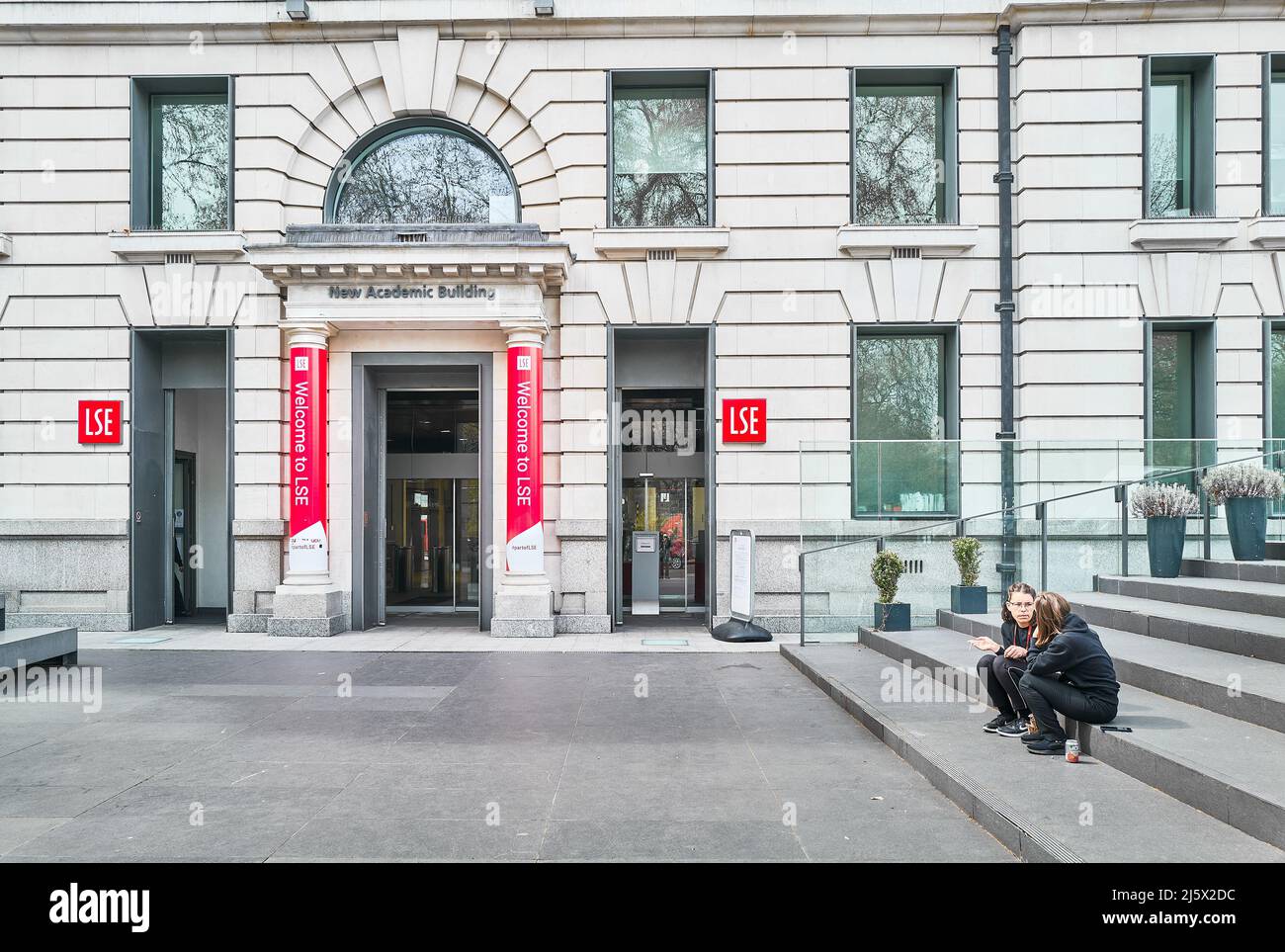 Two students outside the New Academic Building, London School of ...