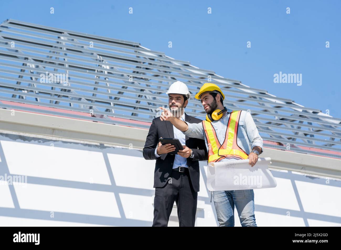 Engineer with business manager are talking in construction site,Project ...