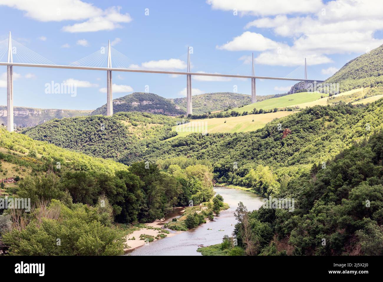View of Tarn river and valley with Millau Viaduct and summer sky with ...